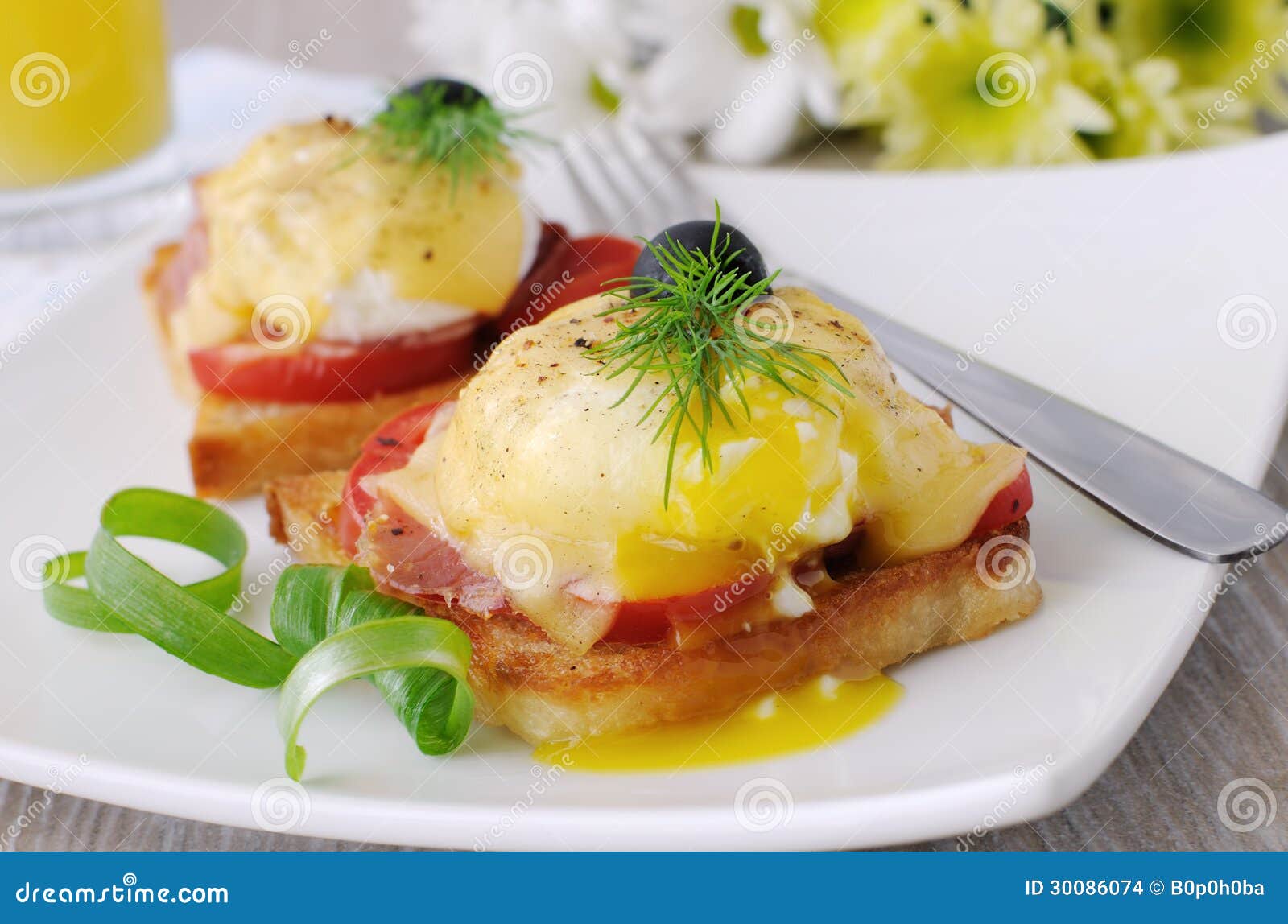 Eggs Benedict with Ham and Tomato on Toast with Cheese Stock Photo ...