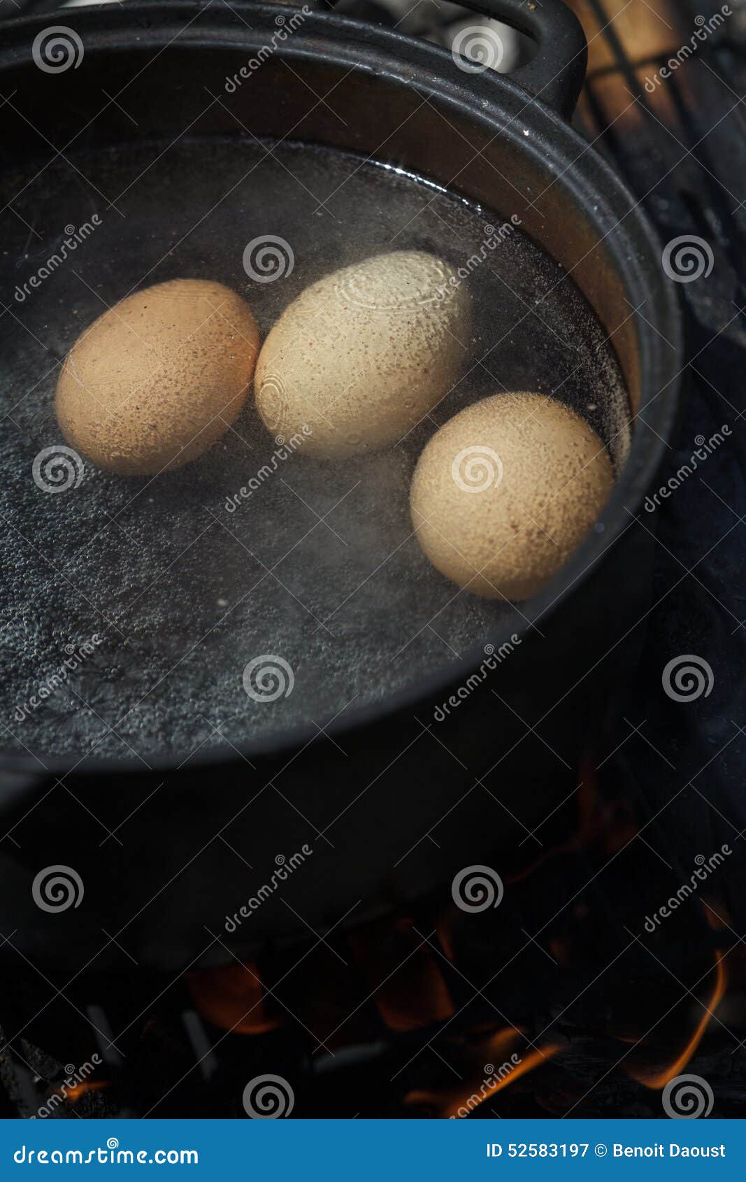 Eggs in a Cast Cauldron Full Boiling Water Stock Image - Image of ...