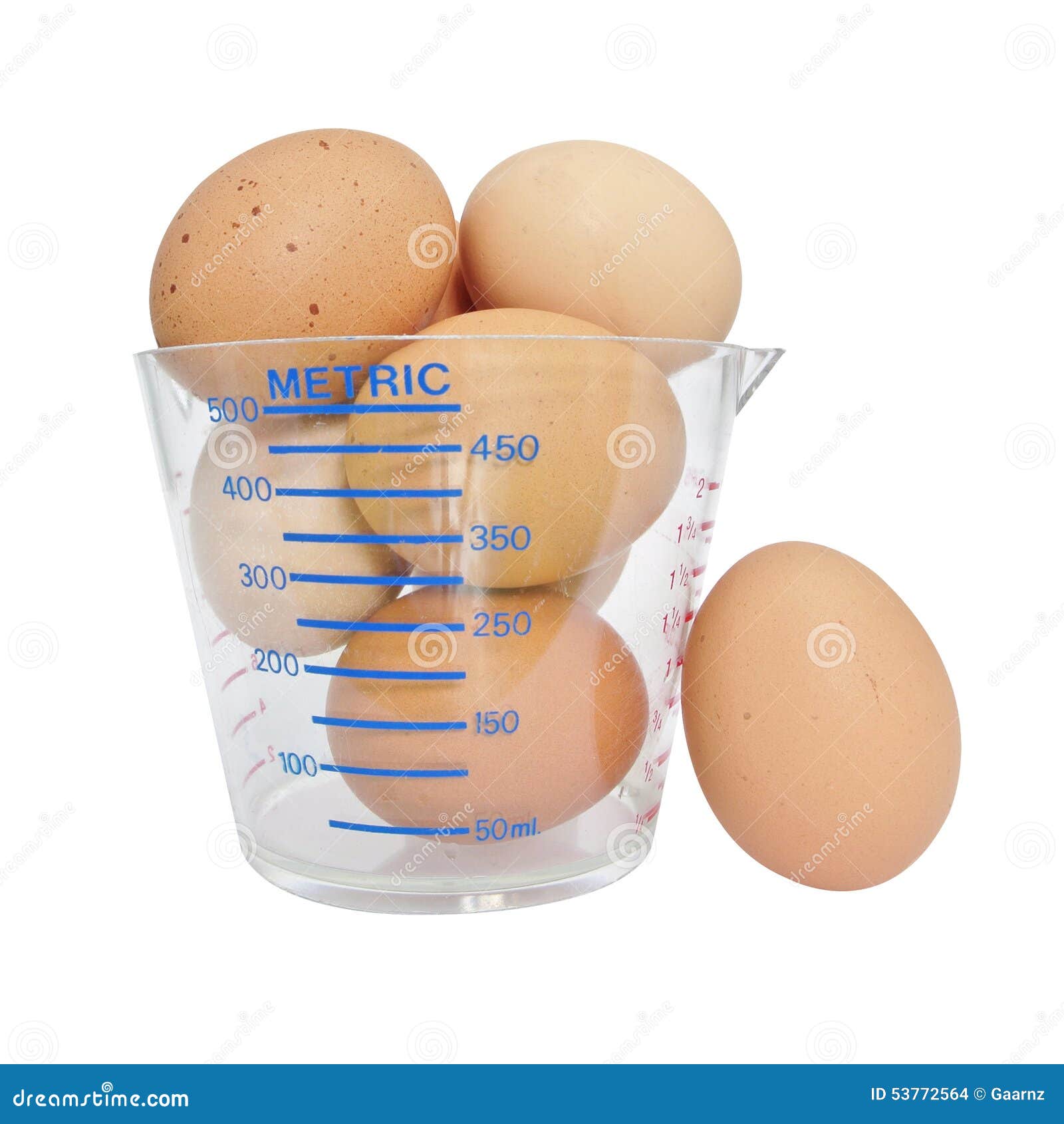 Eggs in measuring cup stock photo. Image of group, food - 53772564