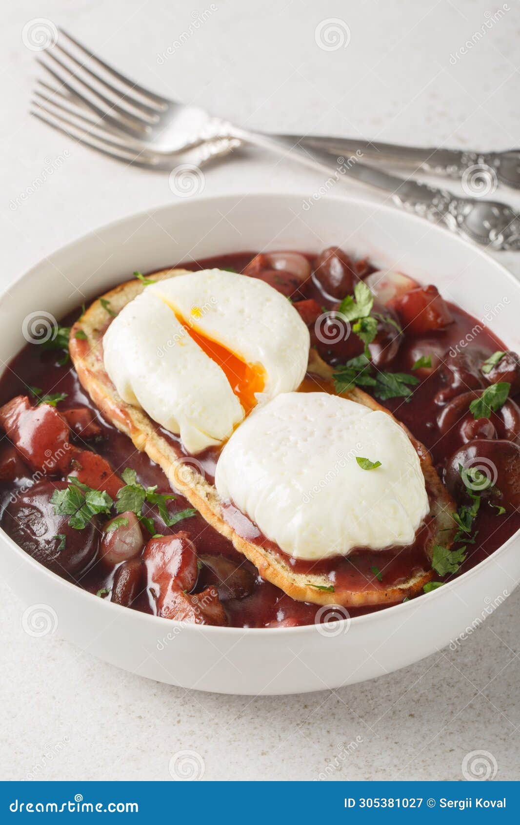 Eggs Meurette or Poached Eggs with Red Wine Sauce Closeup on the Plate ...