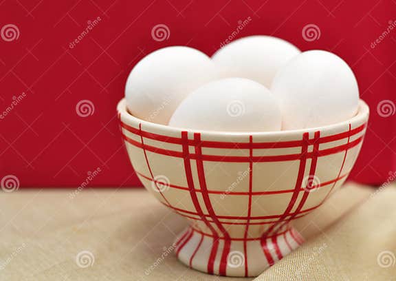 Eggs in a red checked cup stock photo. Image of health - 28683928