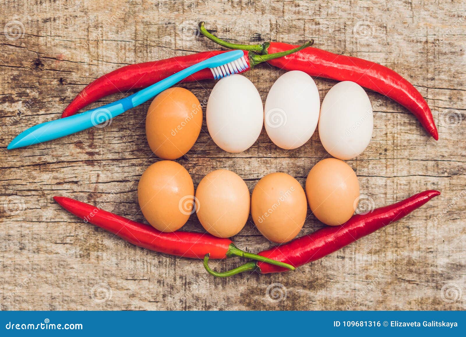 Eggs and Red Pepper in the Form of a Mouth with Teeth. White Eggs are ...