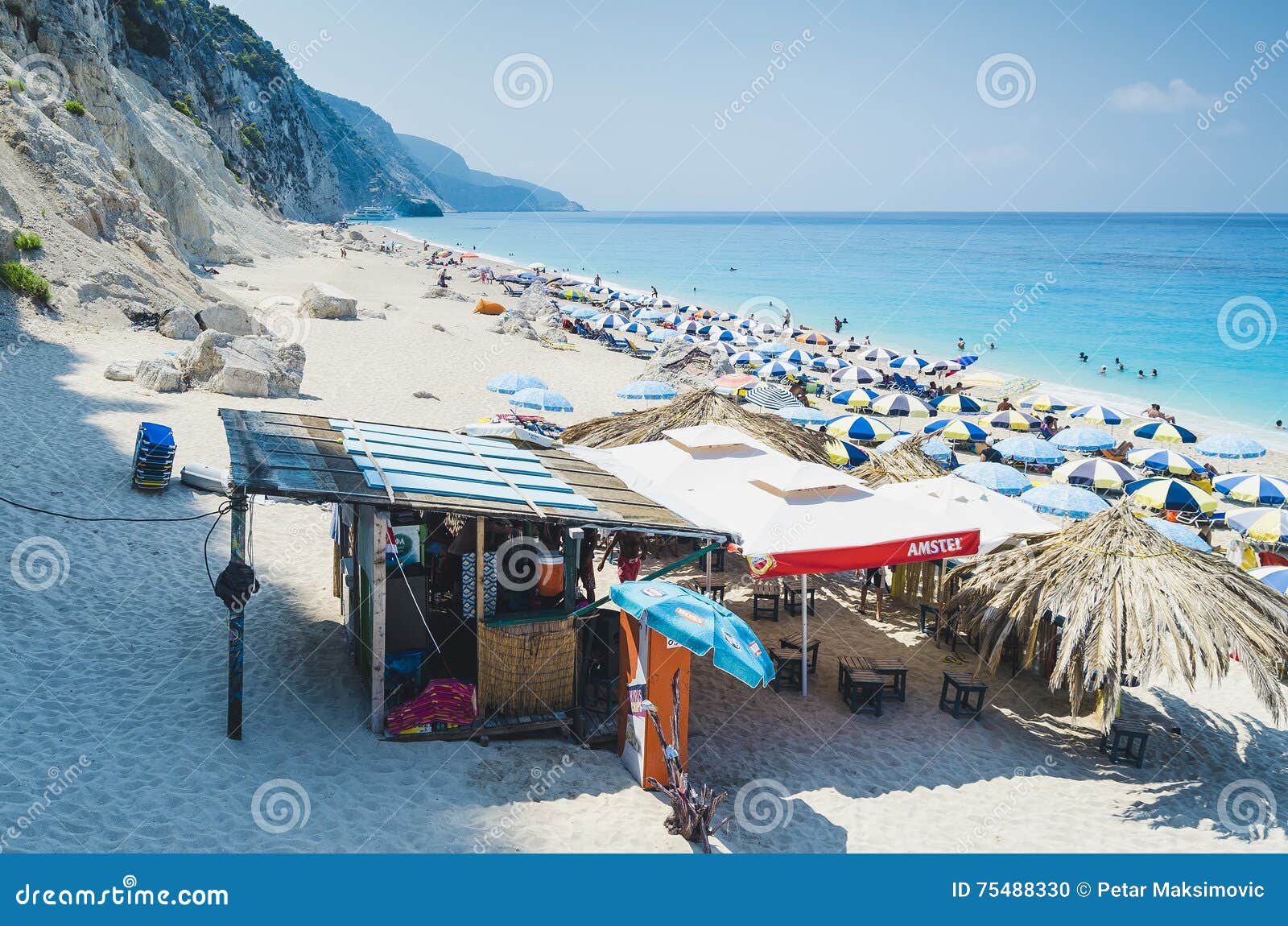 Egremni beach tourists. editorial image. Image of ocean - 75488330