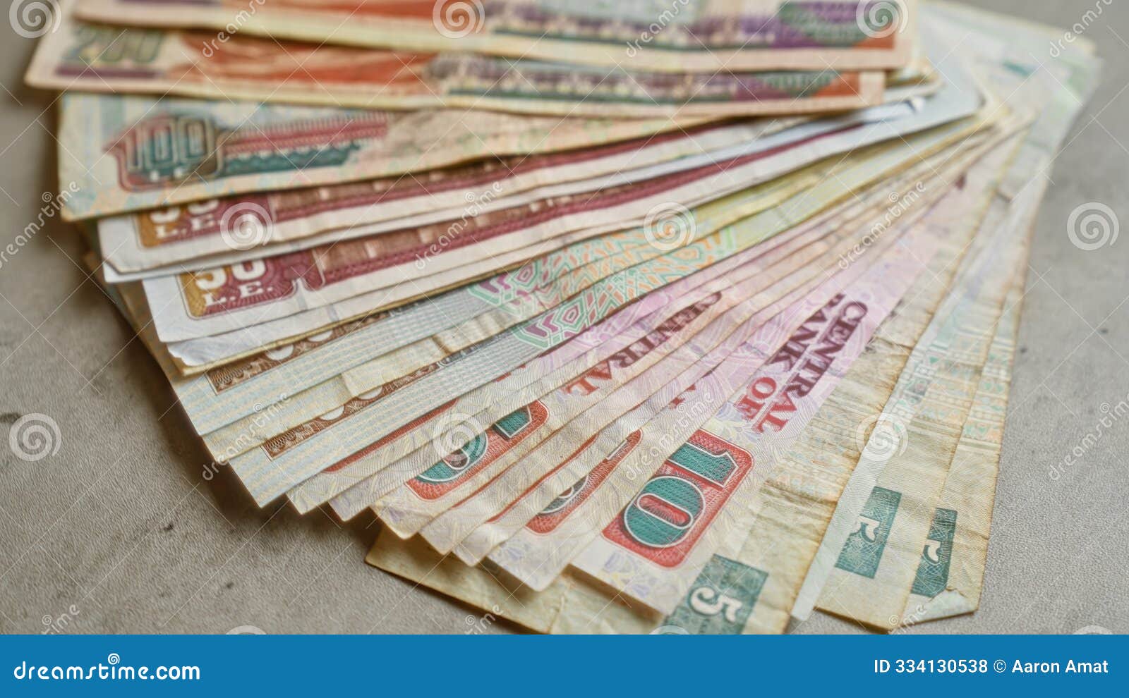 Egyptian Banknotes of Various Denominations Arranged on a Concrete ...