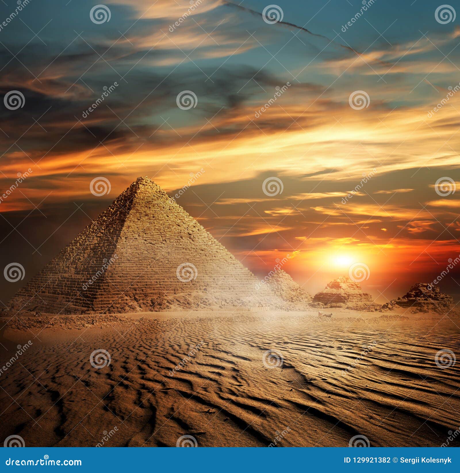 Pyramids in the desert stock photo. Image of evening - 129921382