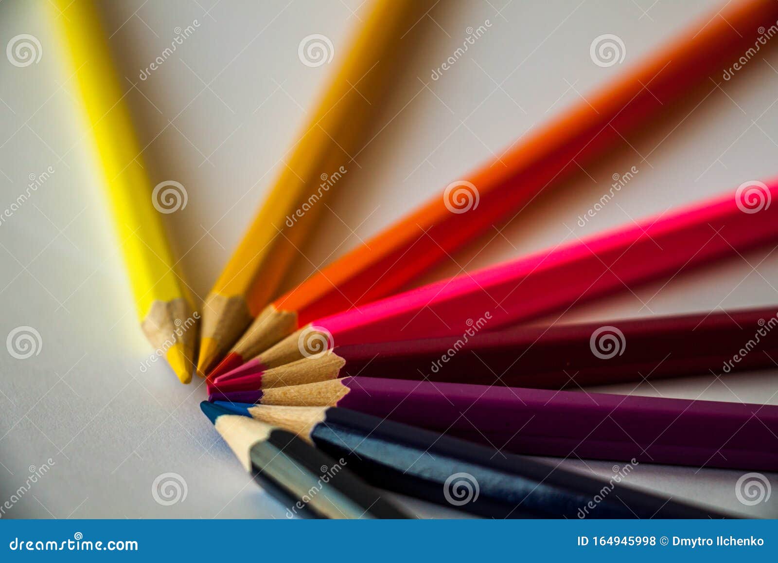Eight Colored Pencils Lie in a Semicircle on White Sheets of Paper ...