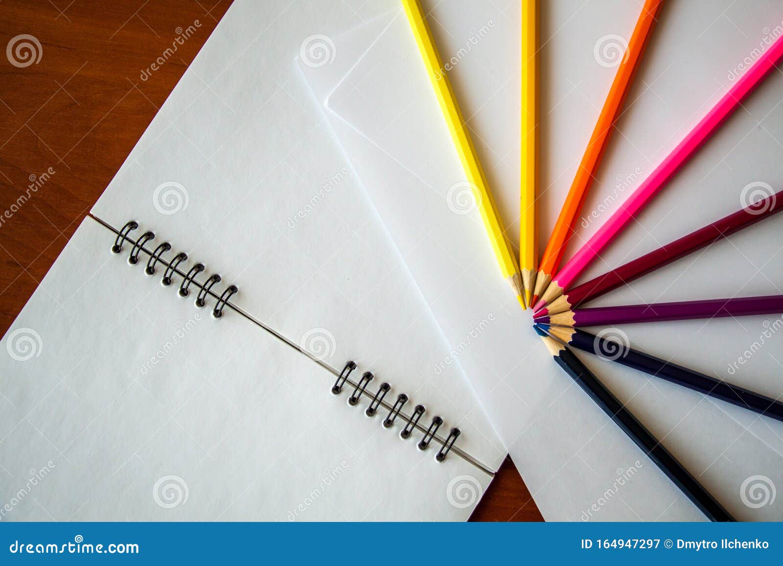 Eight Colored Pencils Lie in a Semicircle on White Sheets of Paper ...