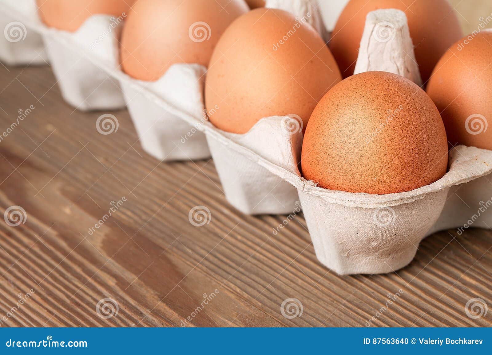 Eight Eggs in Box on a Wooden Table Stock Photo - Image of brown ...