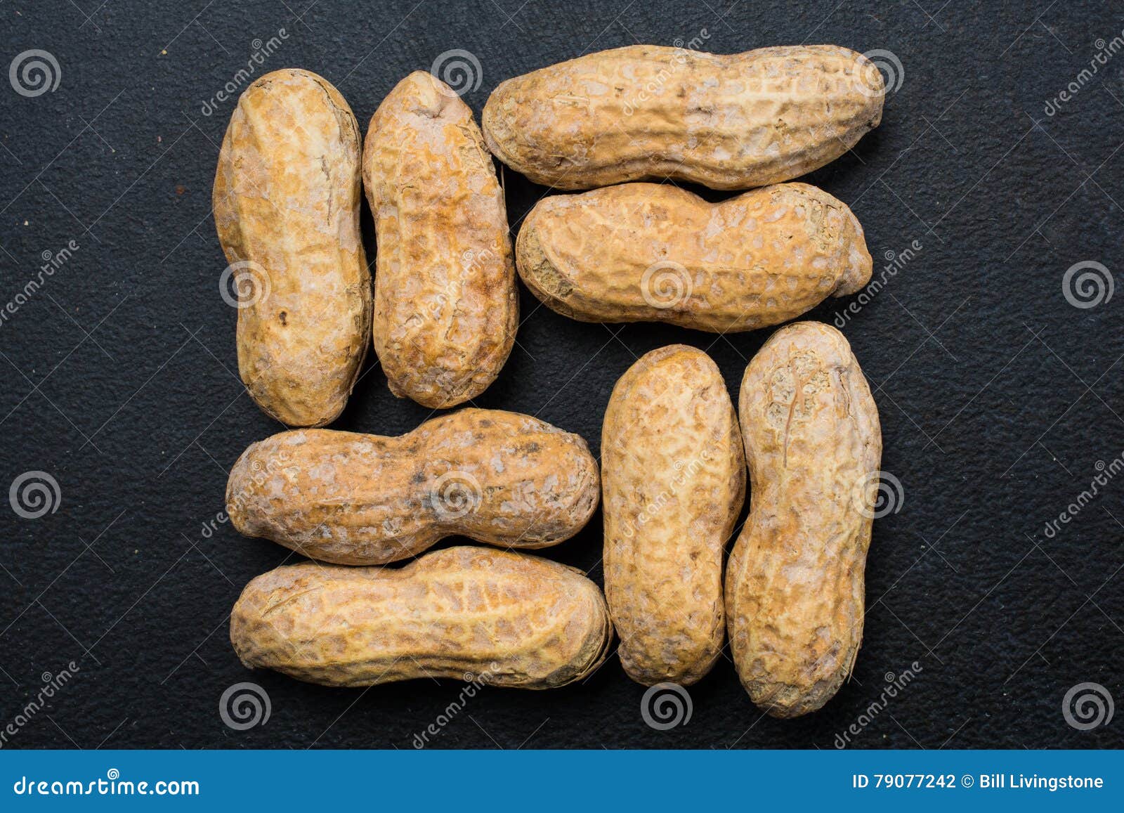 Eight Peanuts in Square Pattern on a Black Surface Stock Photo - Image ...