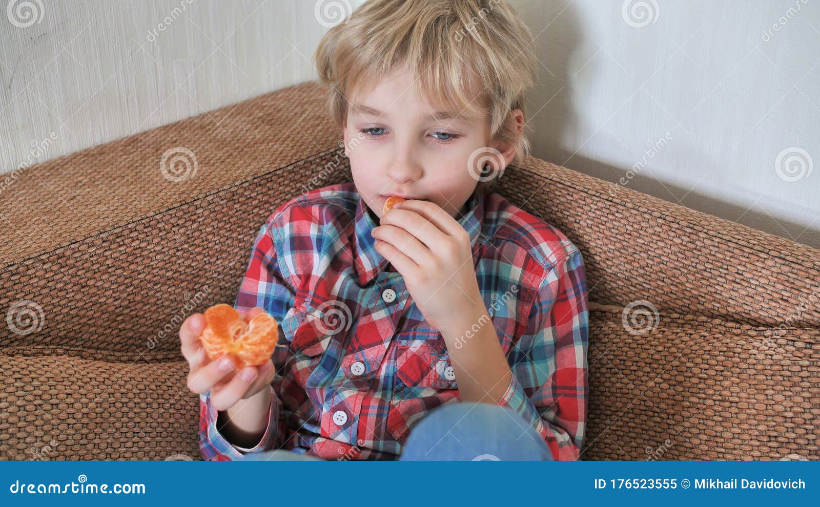 Eight Year Old Boy Eats Mandarin at Home Stock Image - Image of juicy ...