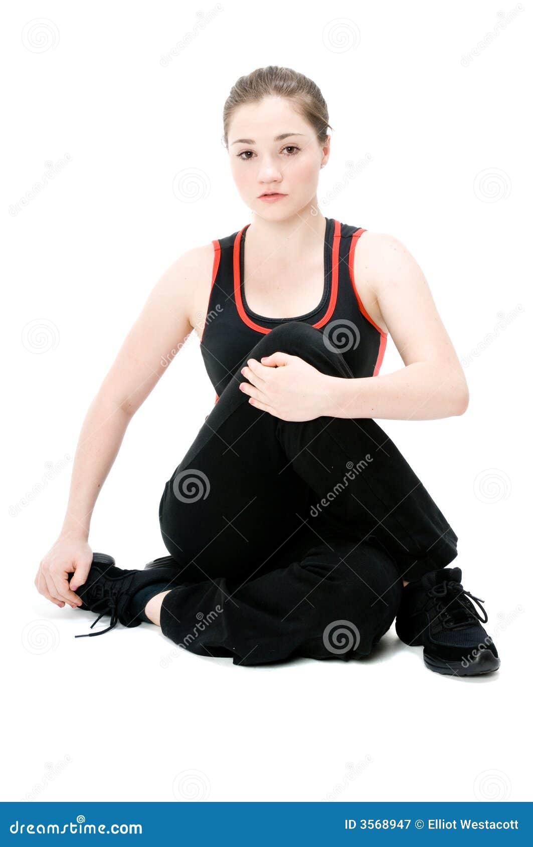 El Estirar De La Chica Joven Imagen de archivo - Imagen de sano ...