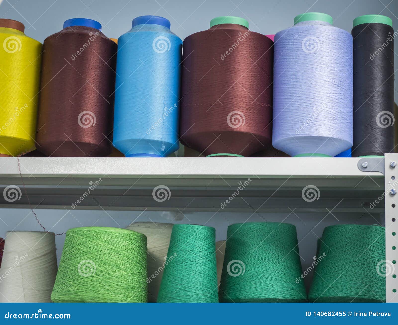 Elastic and Cotton Threads on Spools on the Shelf in Production Stock ...