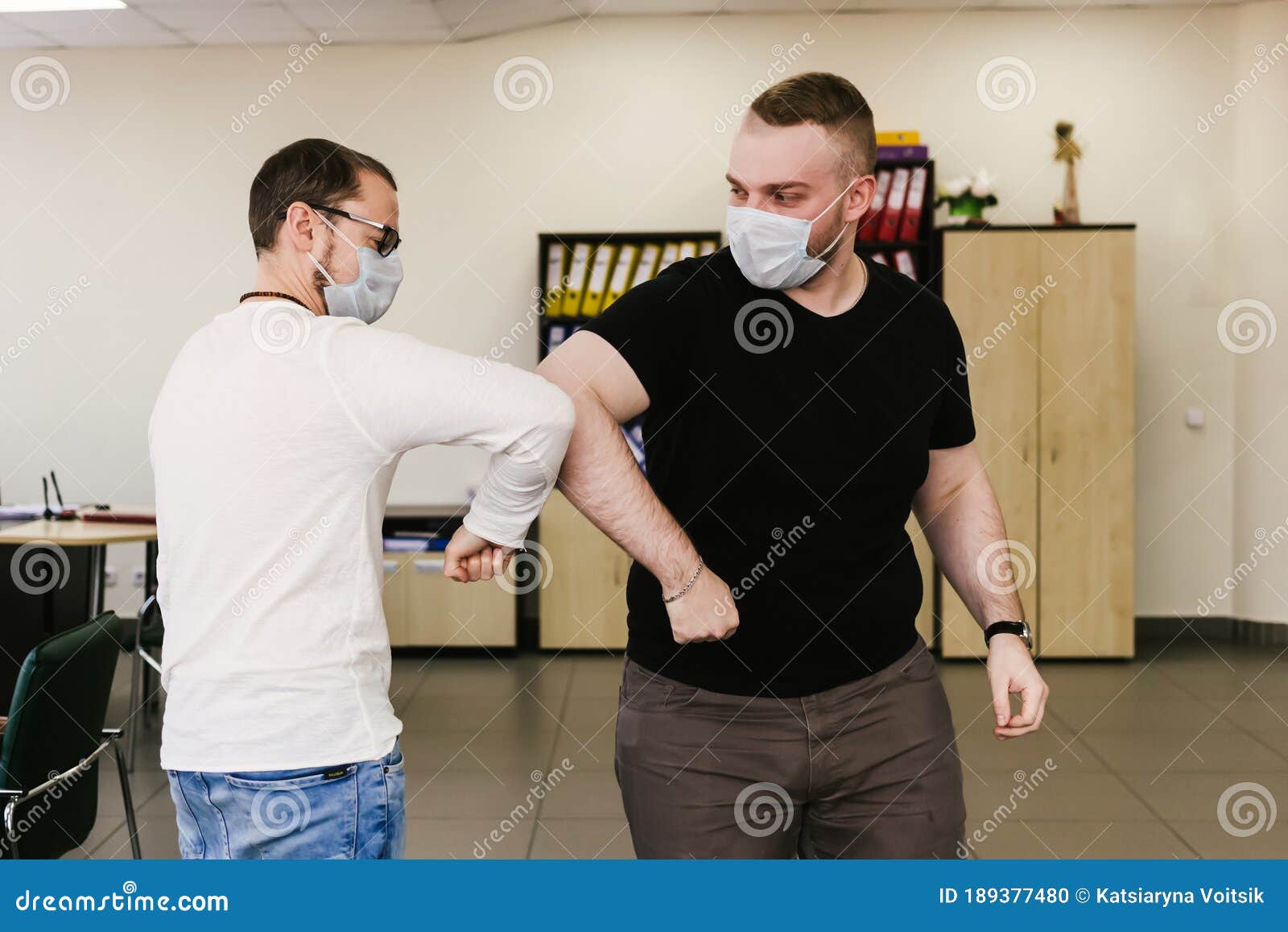 Two People Bump Elbows instead of Hug Stock Photo - Image of friendship ...