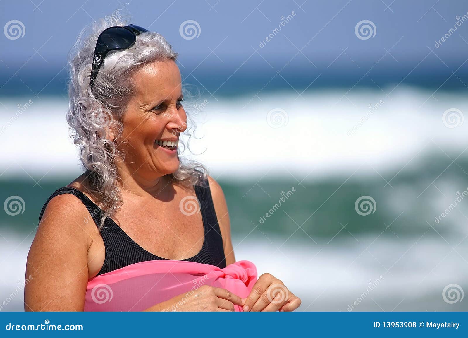 Elder female at the beach stock photo. Image of vacation - 13953908