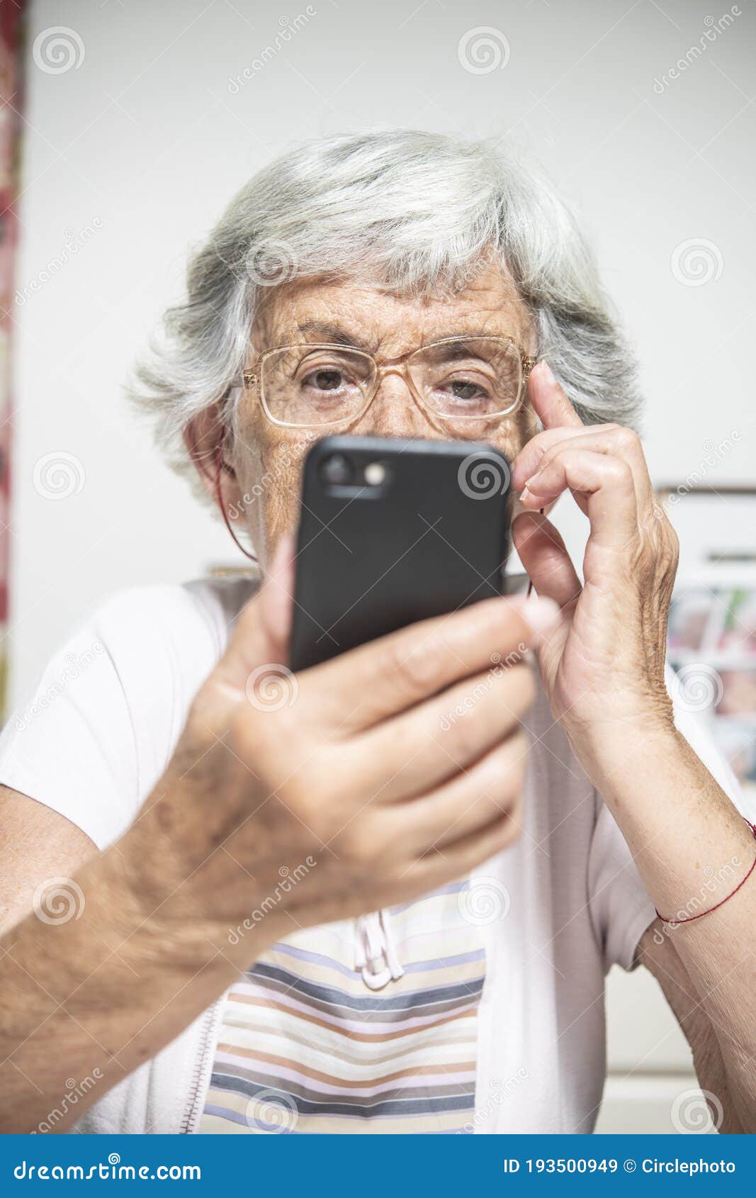 An Elder Lady Using a Smartphone Stock Image - Image of lifestyle, desk ...