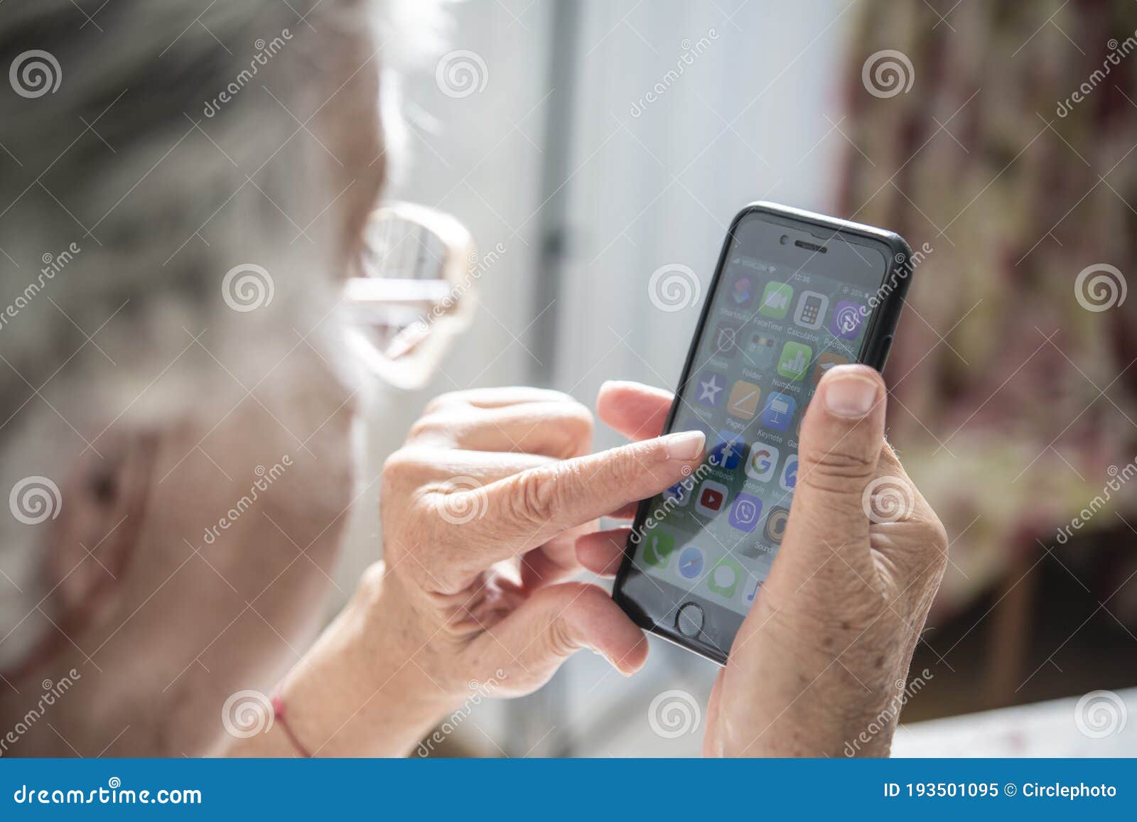 An Elder Lady Using a Smartphone Editorial Image - Image of hair ...