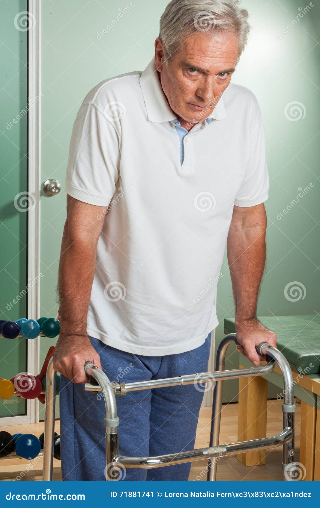 ELder man using a walker stock image. Image of people - 71881741