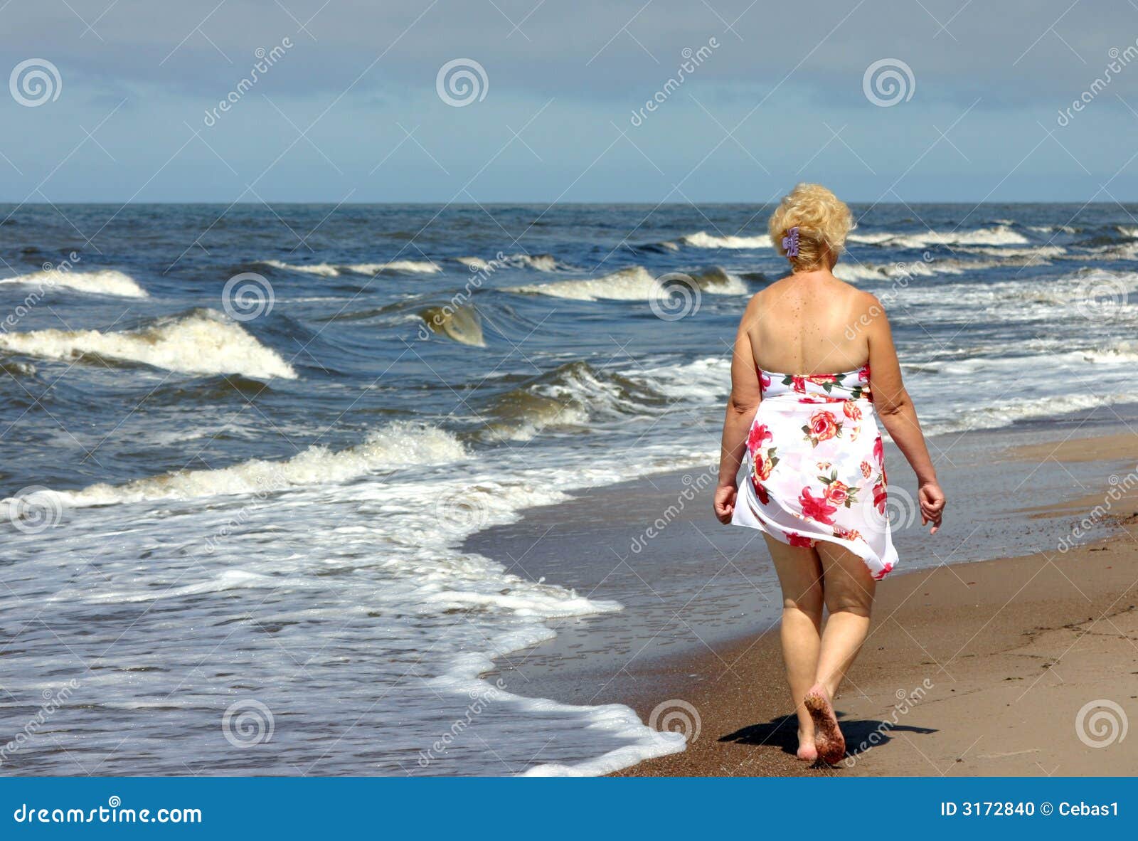 Elder woman on the beach stock photo. Image of elderly - 3172840