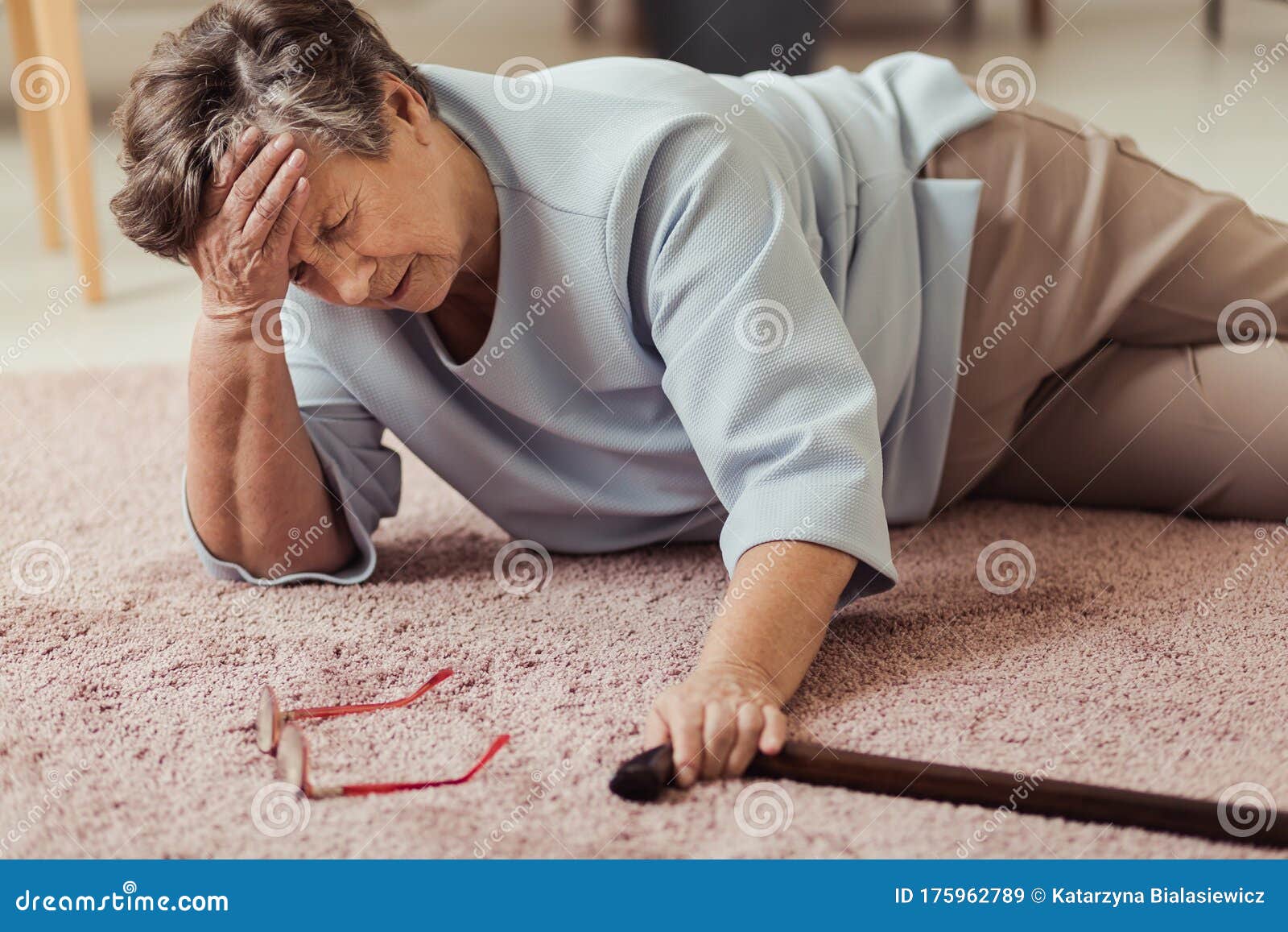 Elder Woman Lying on a Floor and Touching Her Head Stock Image - Image ...