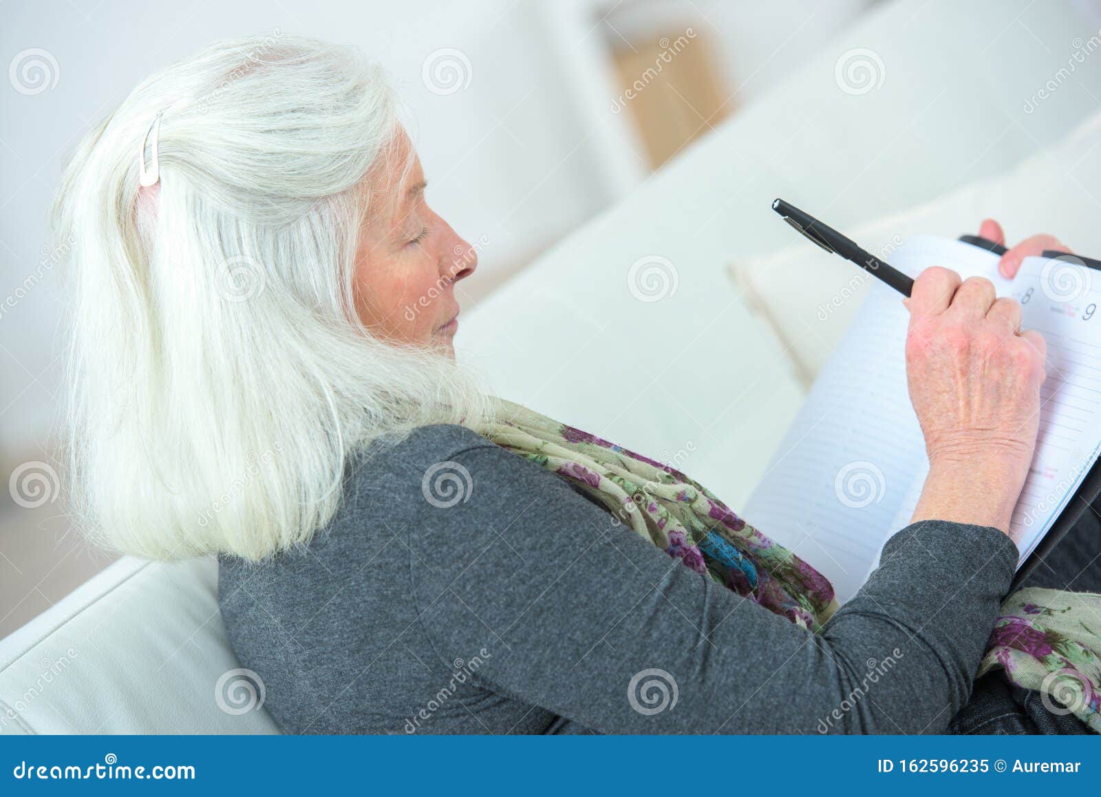 Elder Woman Writing in Notebook Stock Image - Image of smile, beautiful ...
