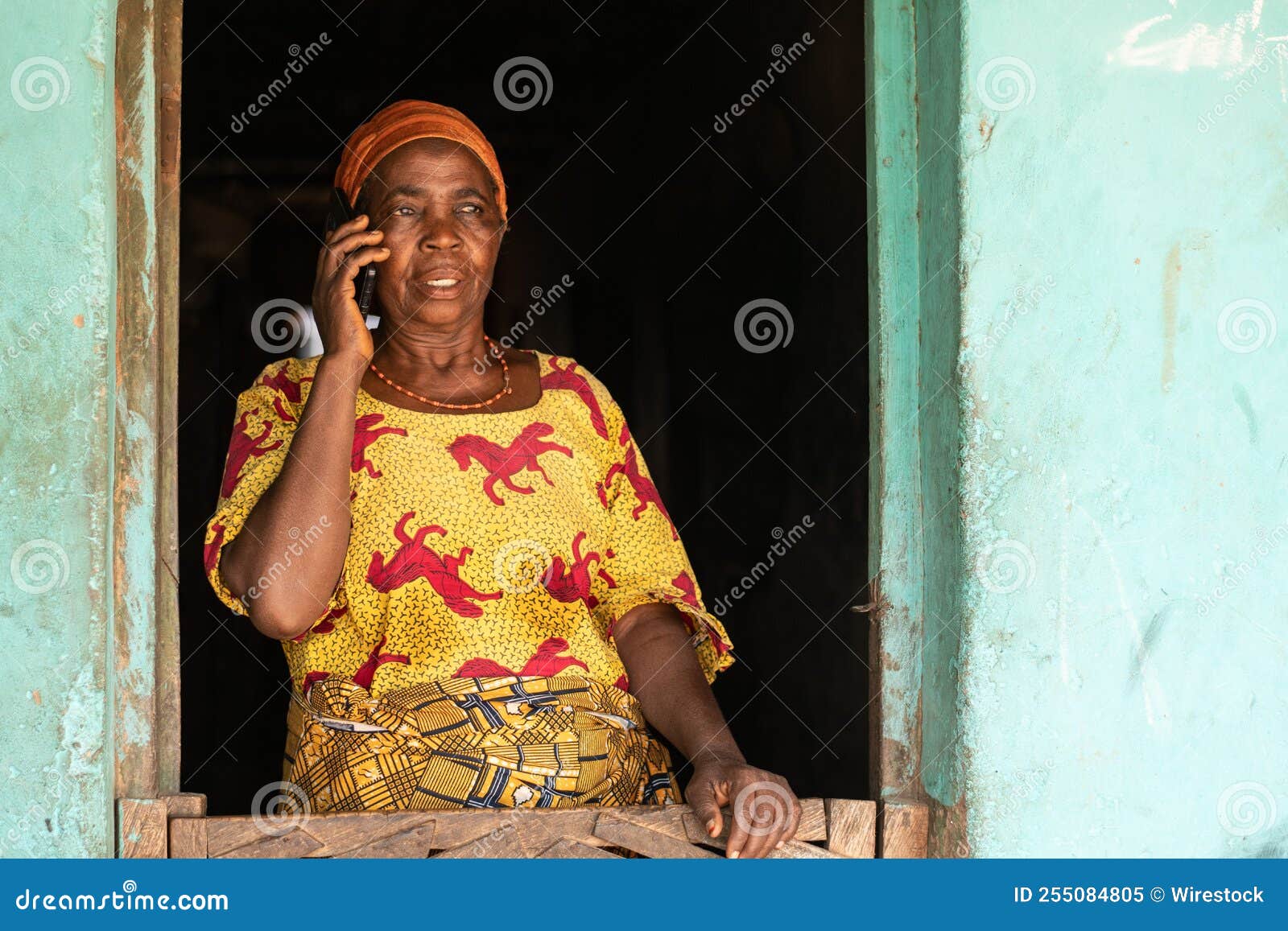 An Elderly African Woman Making a Phone Call Stock Image - Image of ...