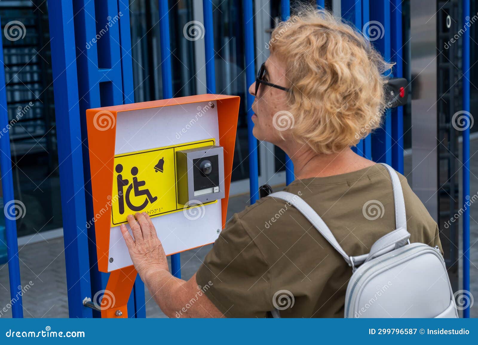 An Elderly Blind Woman Reading a Text in Braille. Button for Calling ...
