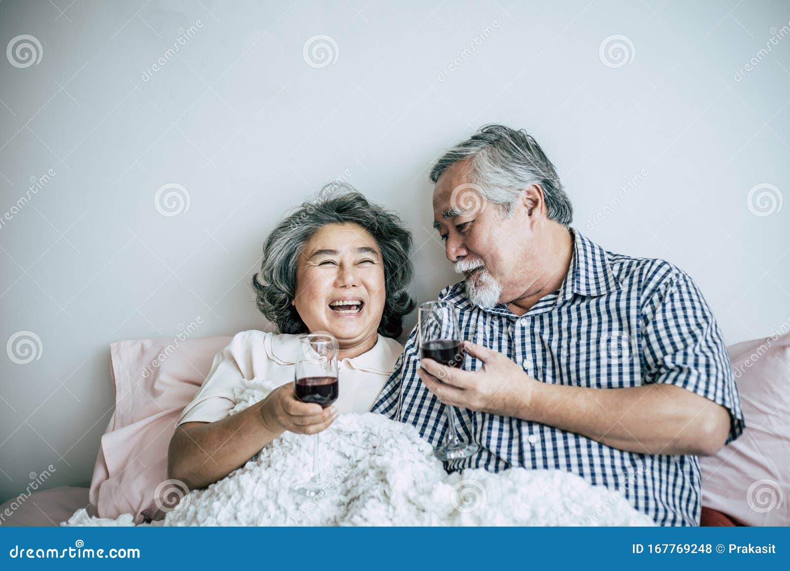 Elderly couple in bed room stock photo. Image of happiness - 167769248