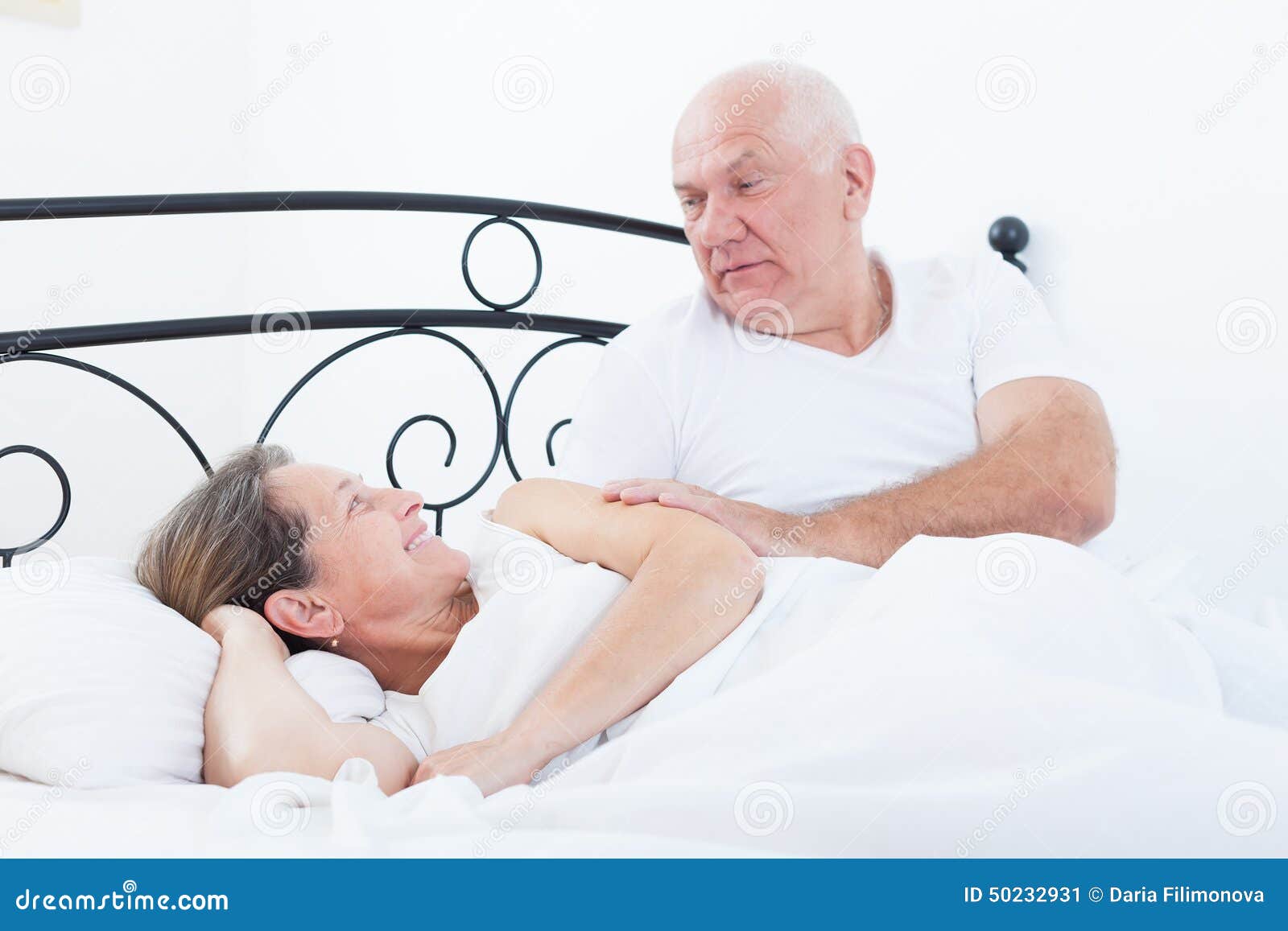 Elderly couple in bed. stock image. Image of woman, embrace - 50232931