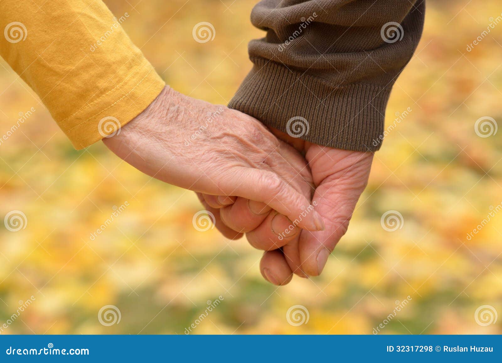 Elderly Couple Holding Hands Stock Photo - Image of hands, outside ...