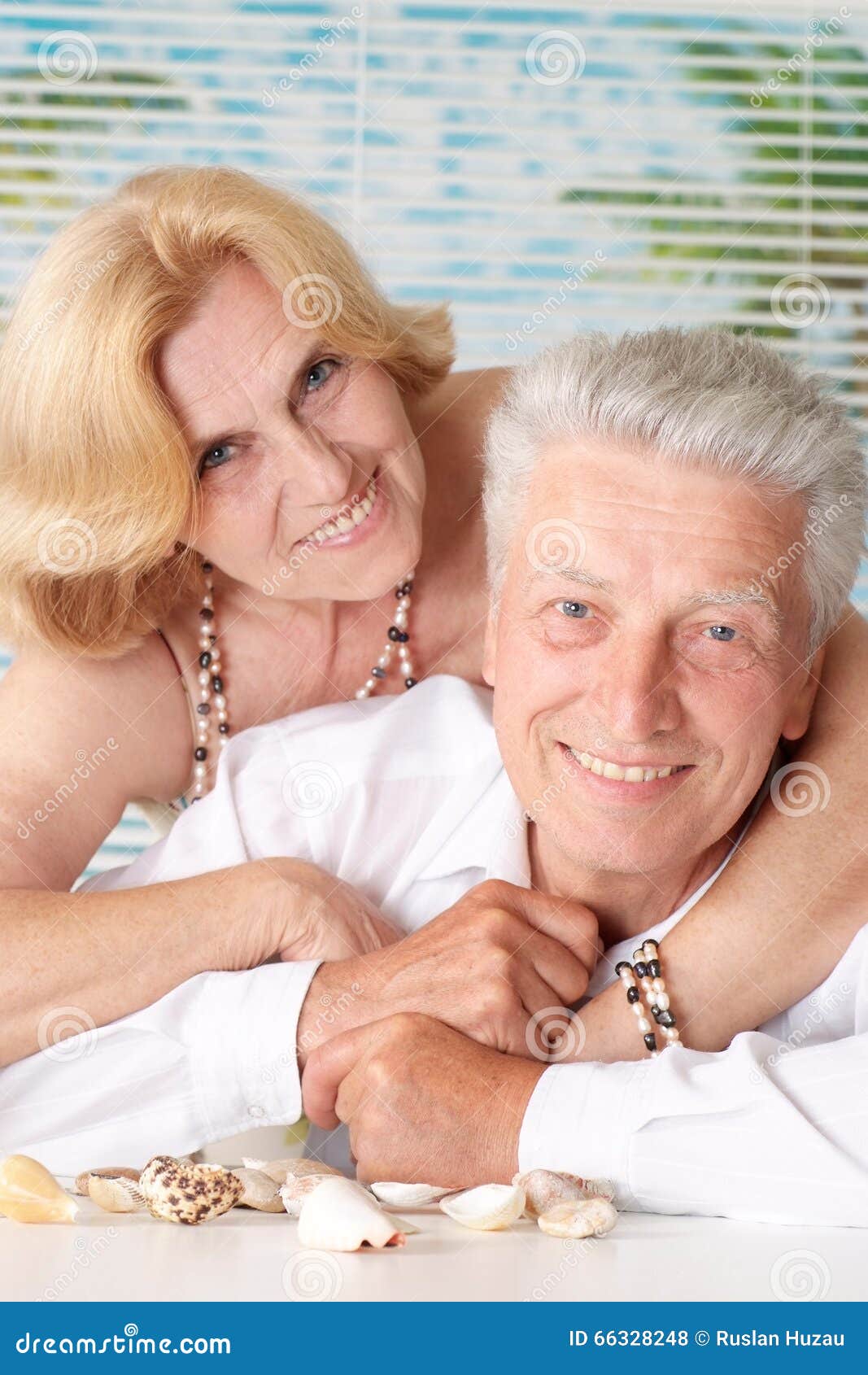 Elderly Couple with Seashells Stock Photo - Image of elderly, portrait ...