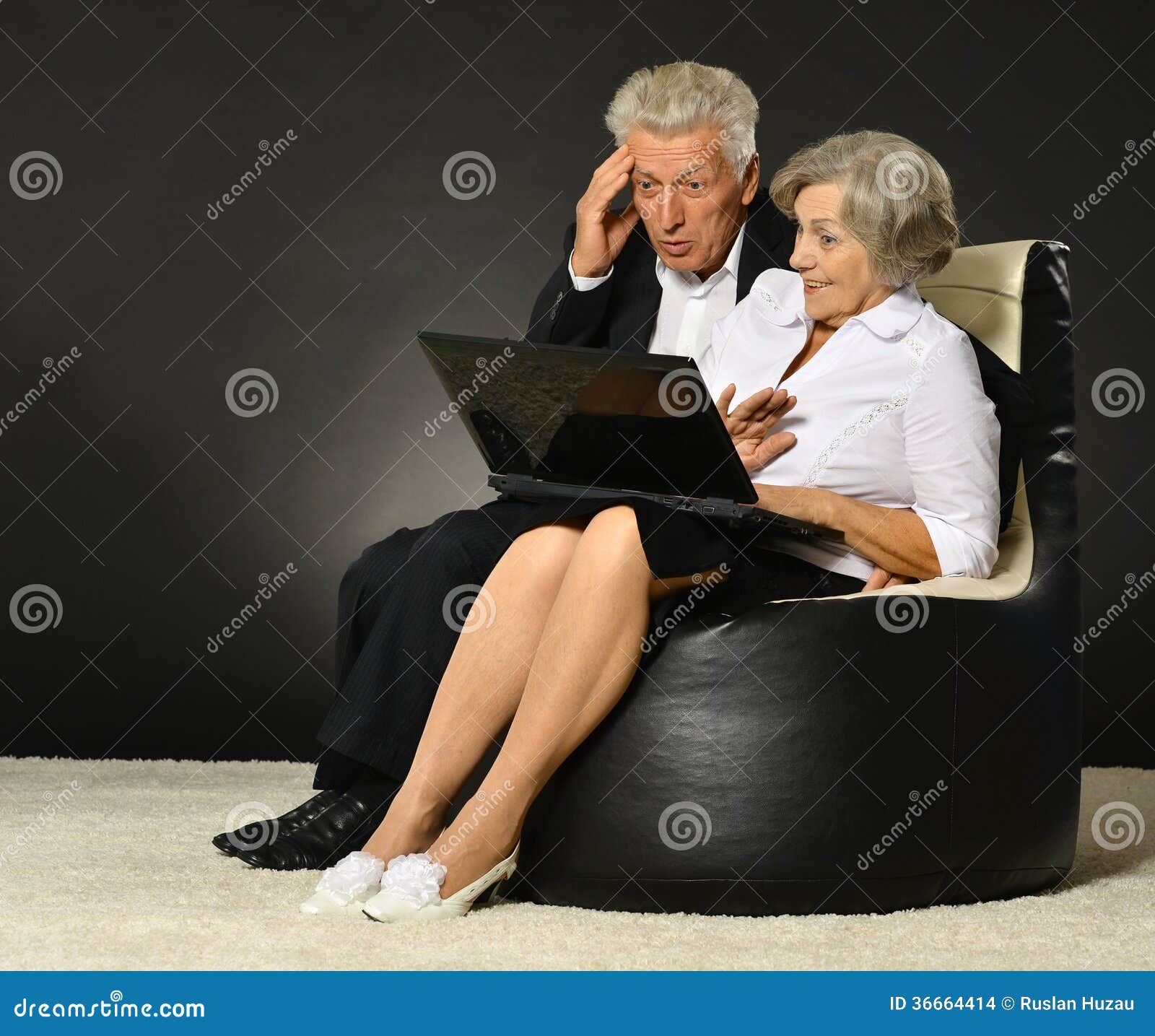 Elderly Couple Using Laptop Stock Photo - Image of laptop, people: 36664414