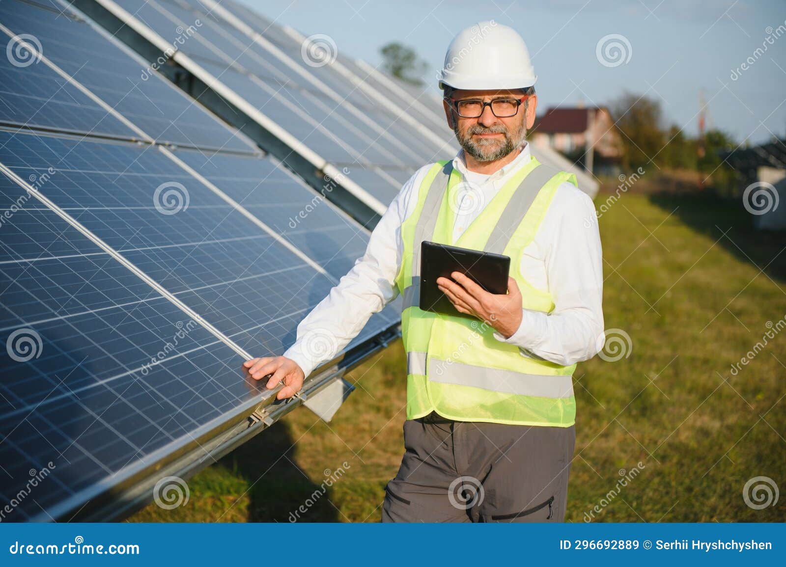 Elderly Engineer is Checking with Tablet an Operation of Sun and ...
