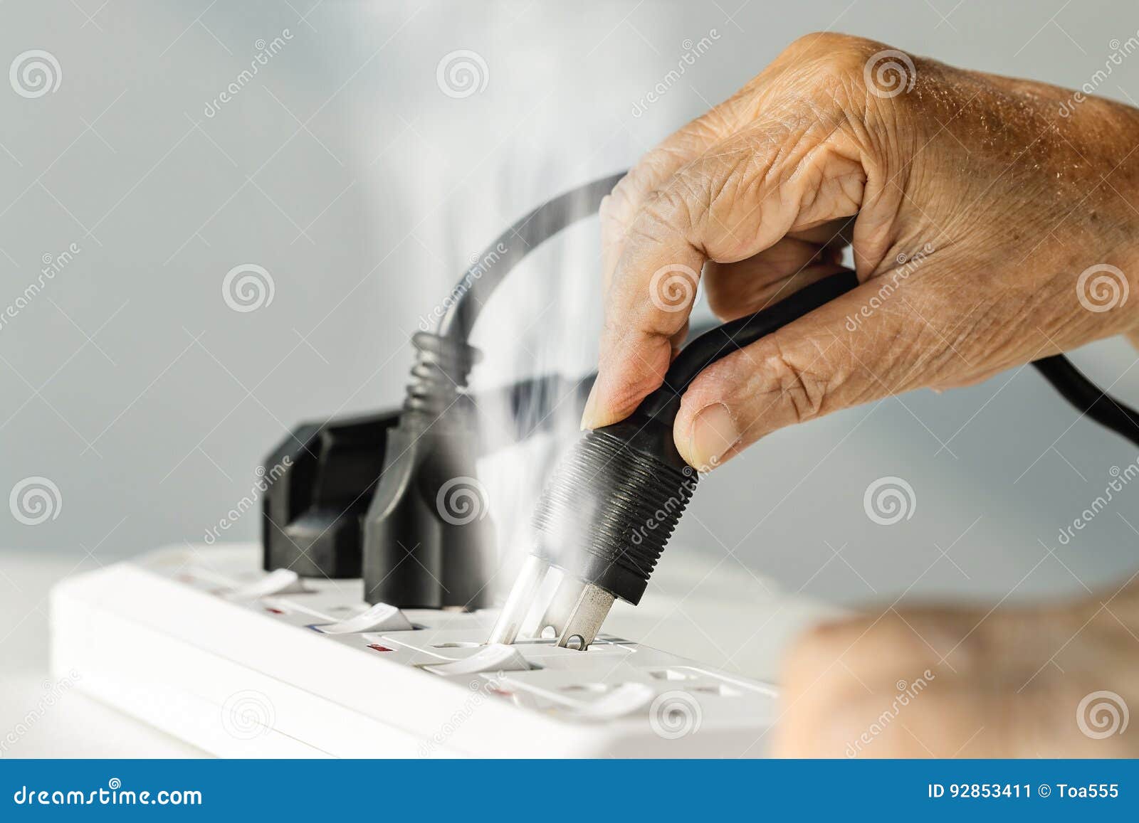 Elderly Hand with Electrical Outlet Spark Stock Image - Image of hand ...