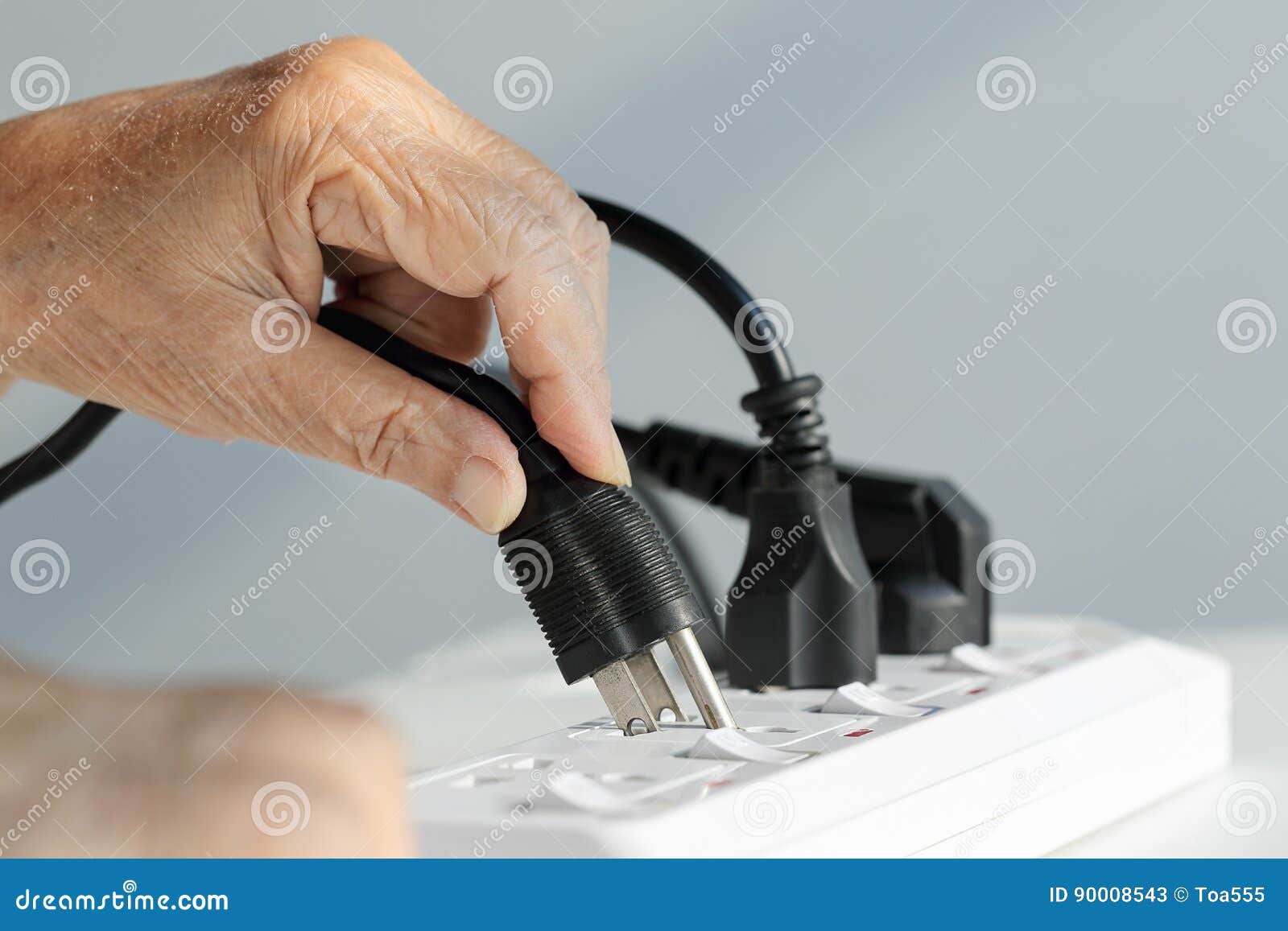 Elderly Hand Plugging into Electrical Outlet Stock Image - Image of ...