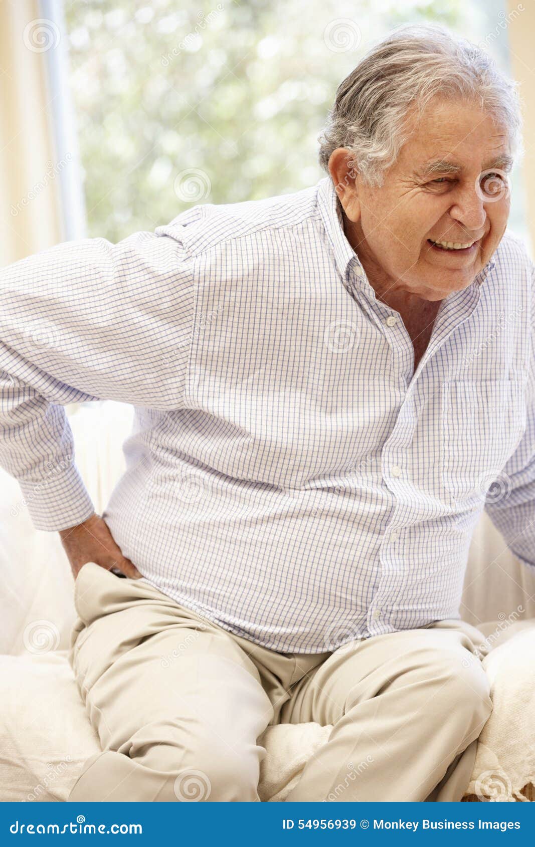 Sad Elderly Hispanic Woman Looking At Phone And Credit Card Royalty ...