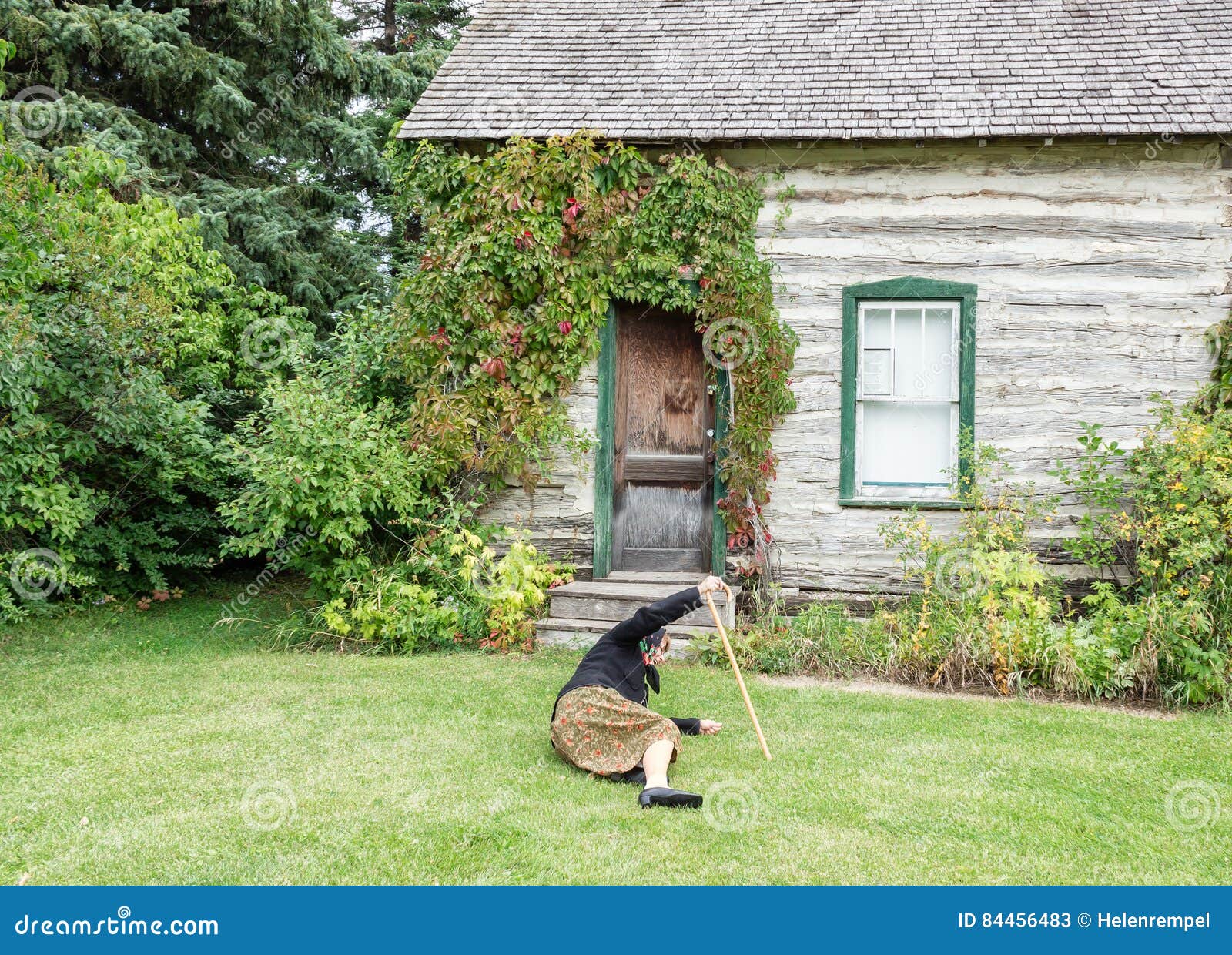 An Elderly Lady Fallen Down on the Green Grass in Front of House. Stock ...