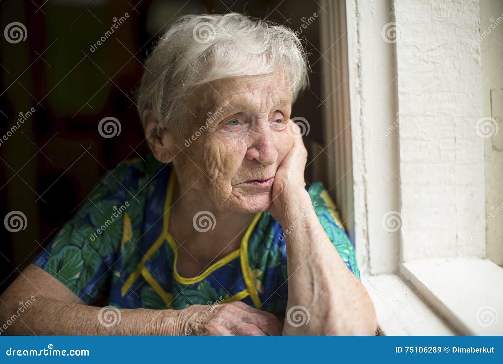 An Elderly Lady Skeptically Looking Out the Window. Sorrow. Stock Image ...