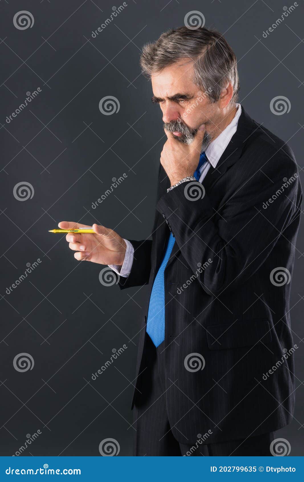 Male Scientist with Pen in Hand Pondering Solution To Problem Stock ...