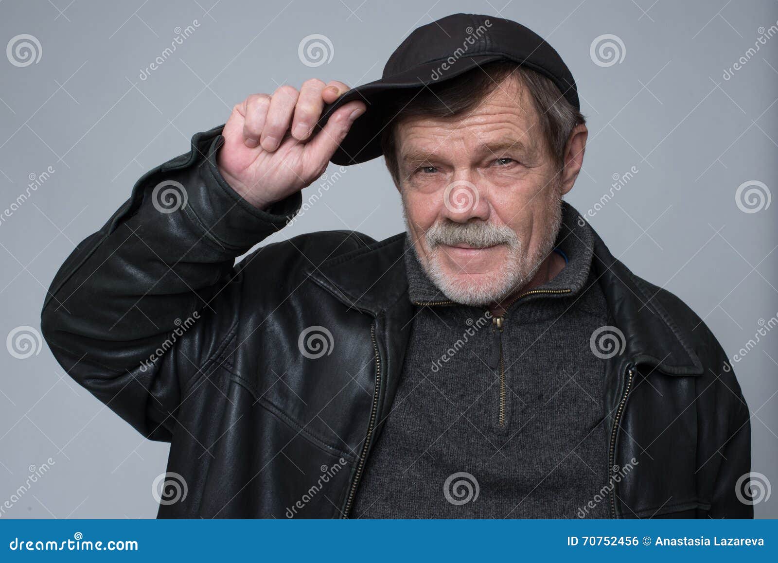 An elderly man in a cap stock photo. Image of expression - 70752456