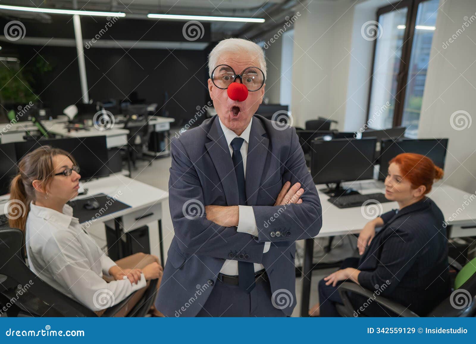 An Elderly Man in a Clown Costume Fools Around at Work. Stock Image ...