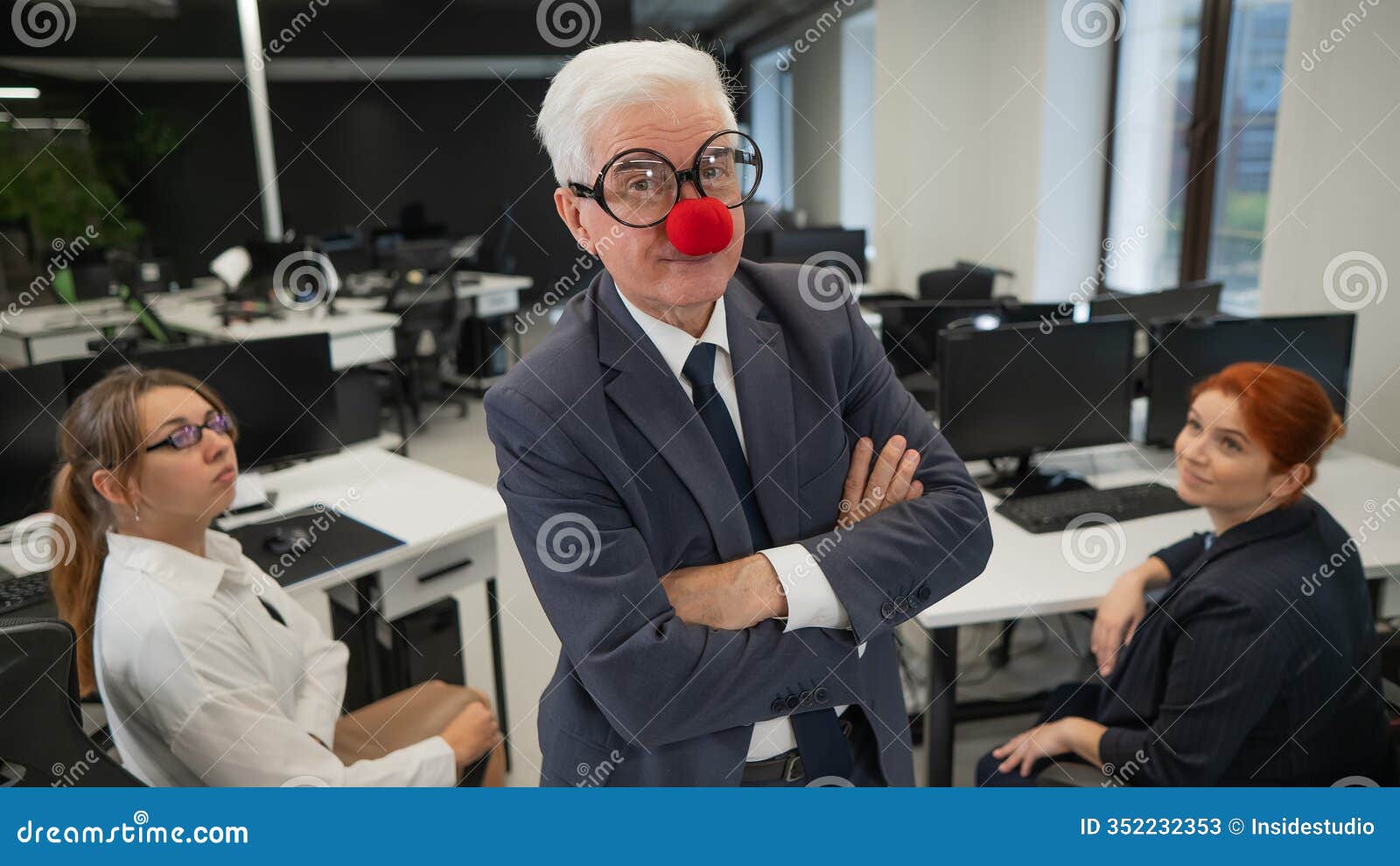 An Elderly Man in a Clown Costume Fools Around at Work. Stock Image ...