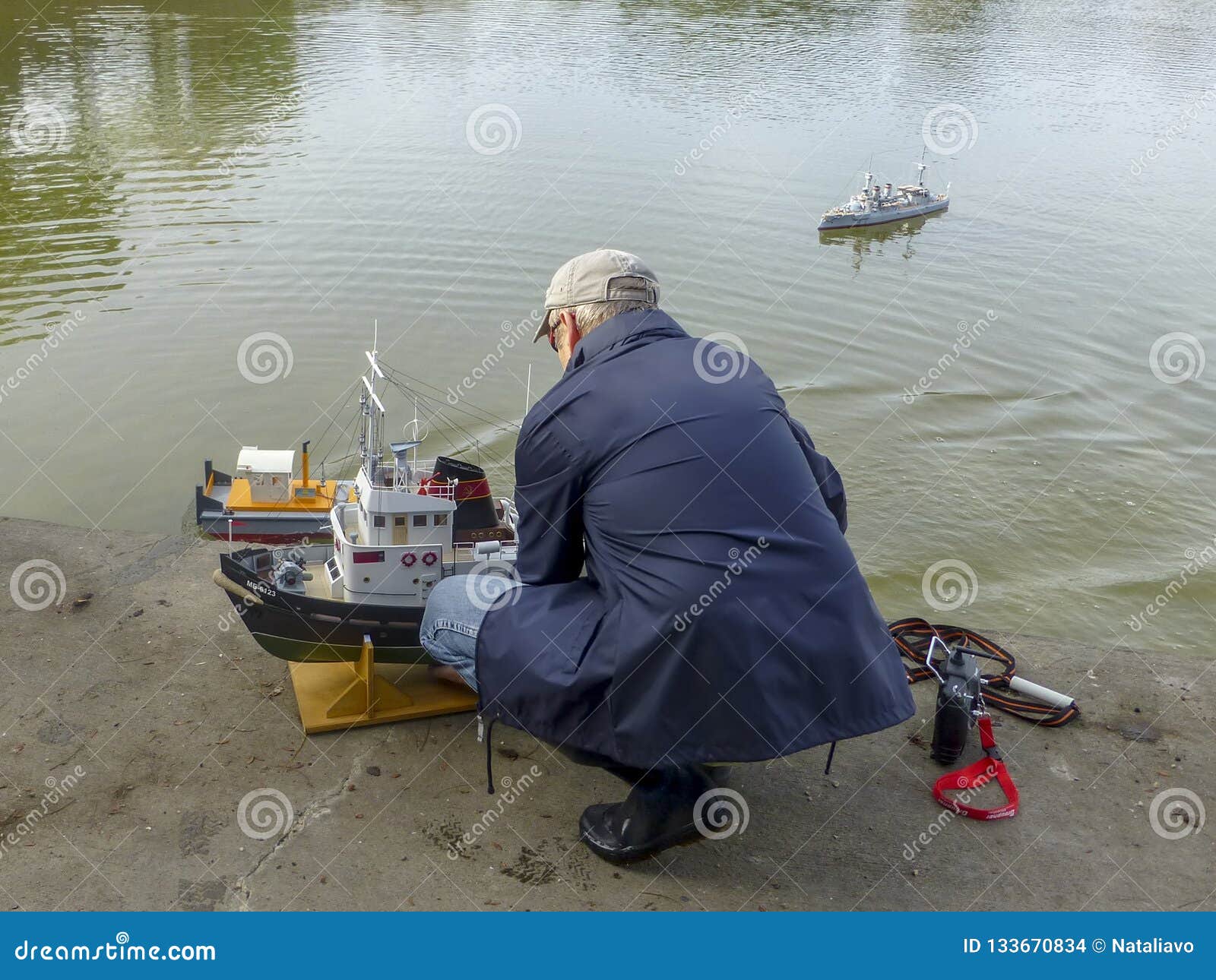 Elderly Man Descends a Sailing Model Ship on the Lake Editorial Stock ...
