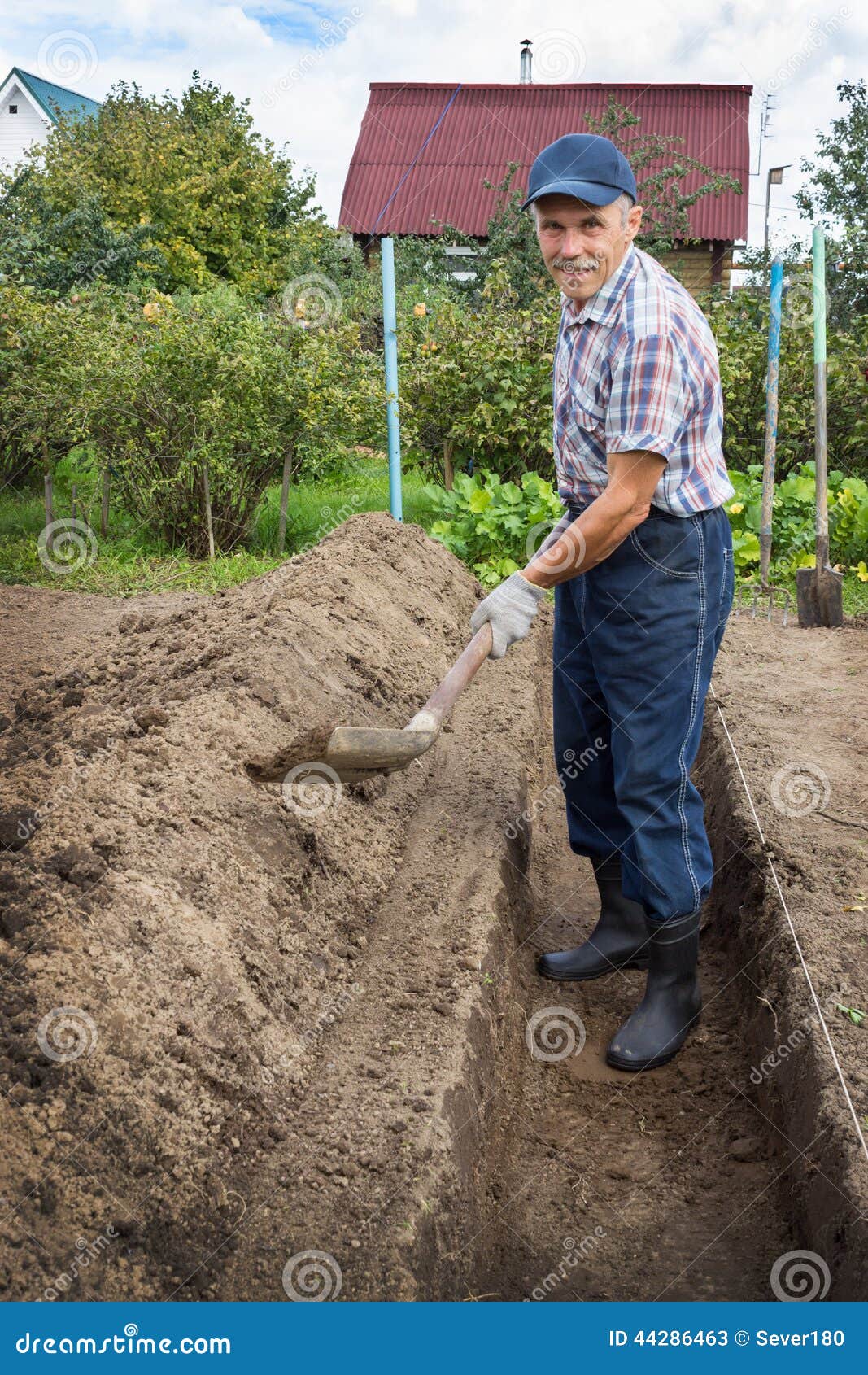 An Elderly Man is Digging the Earth To Build a Deep Bed of Stock Image ...