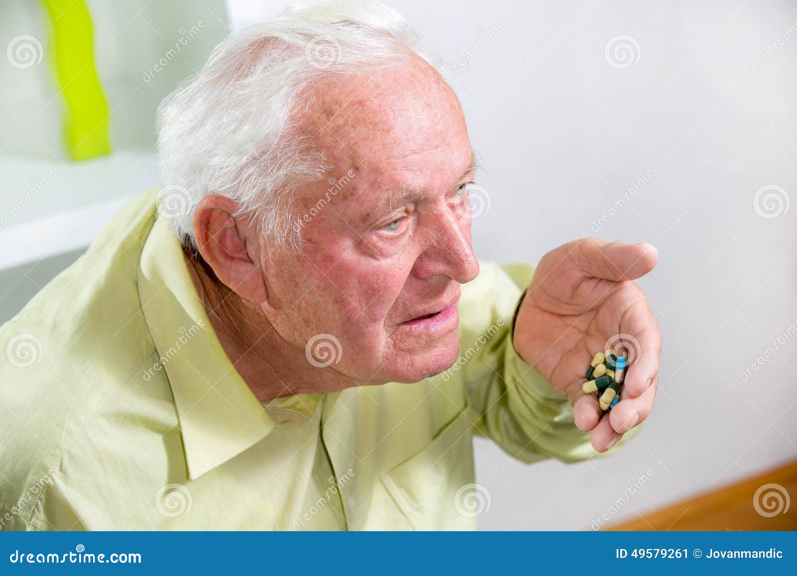 Elderly man drinking pills stock image. Image of depressed - 49579261