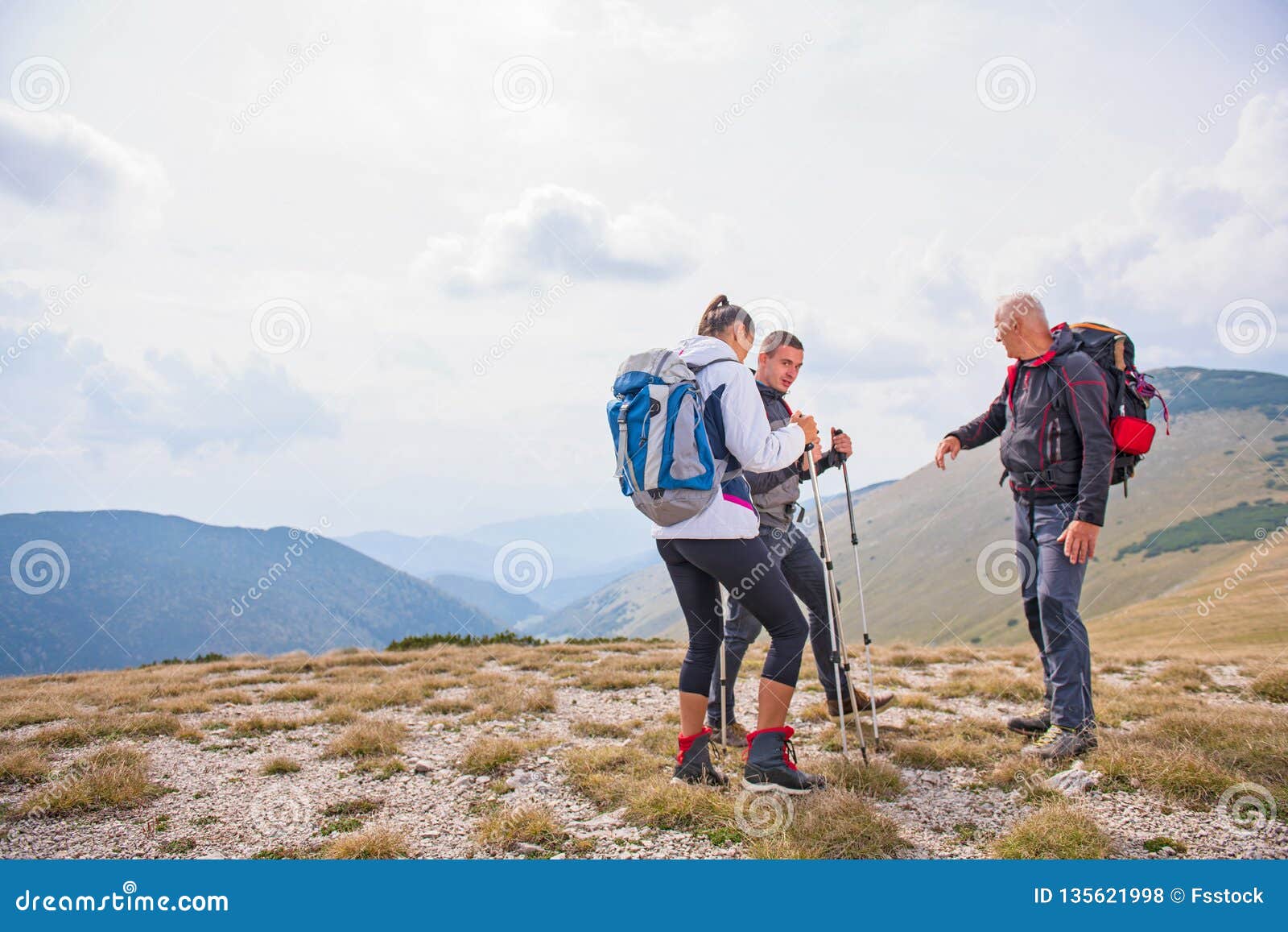 An Elderly Man Giving a Tour for a Young Group of People Stock Photo ...