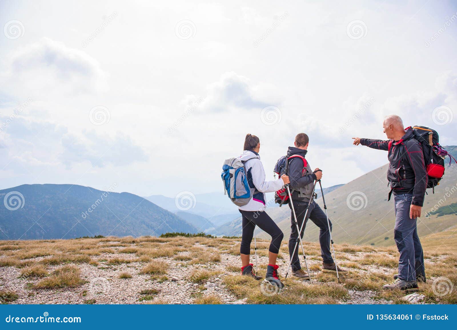 An Elderly Man Giving a Tour for a Young Group of People Stock Image ...