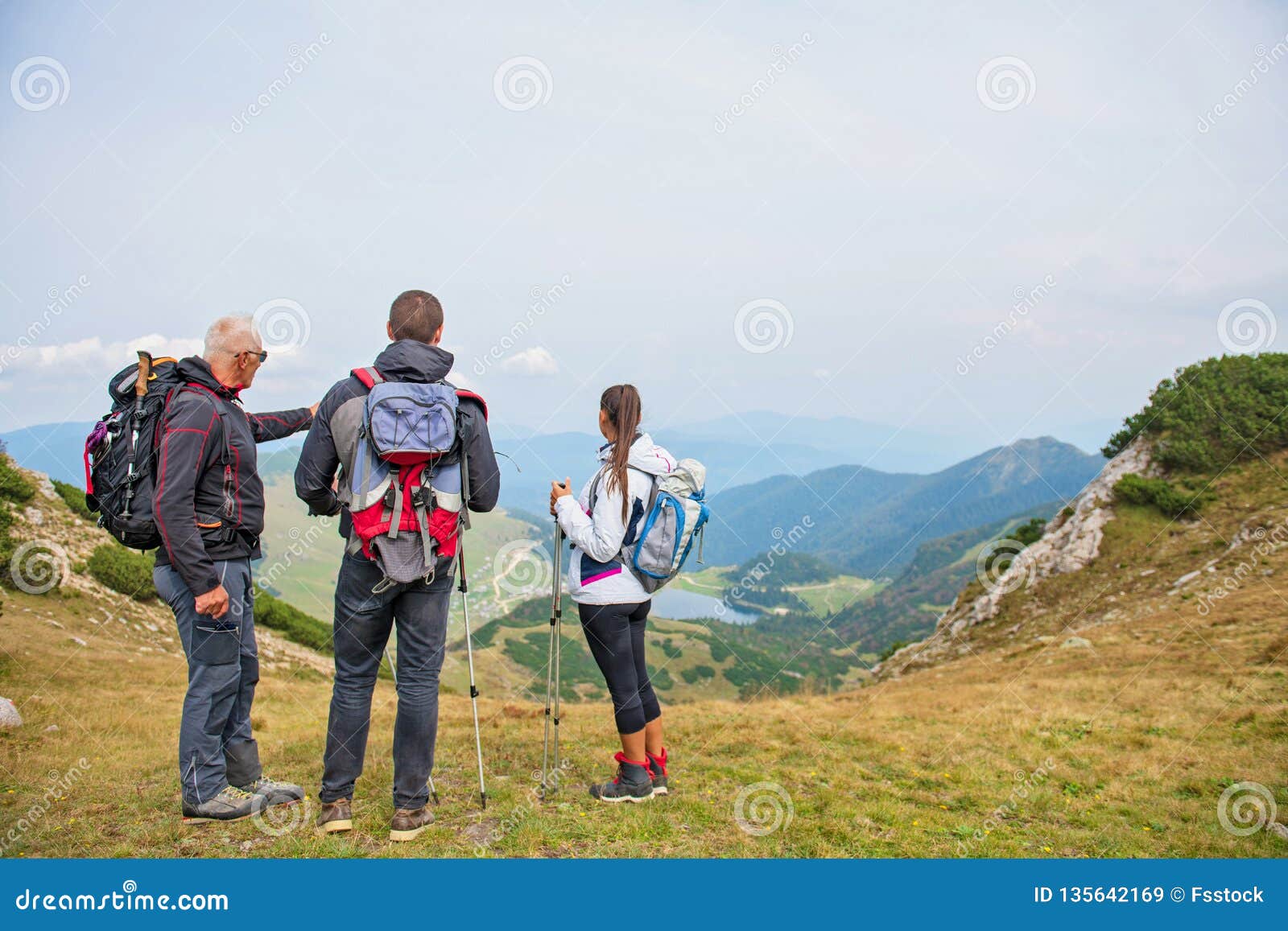 An Elderly Man Giving a Tour for a Young Group of People Stock Image ...