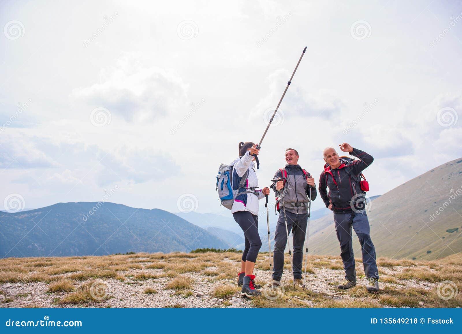 An Elderly Man Giving a Tour for a Young Group of People Stock Photo ...