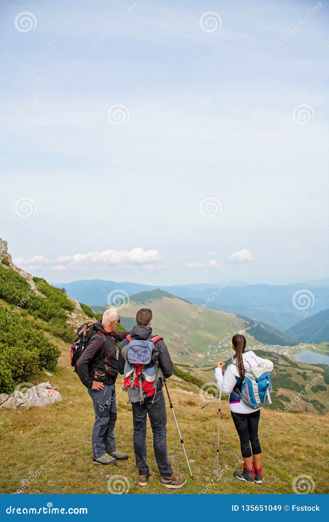 An Elderly Man Giving a Tour for a Young Group of People Stock Image ...