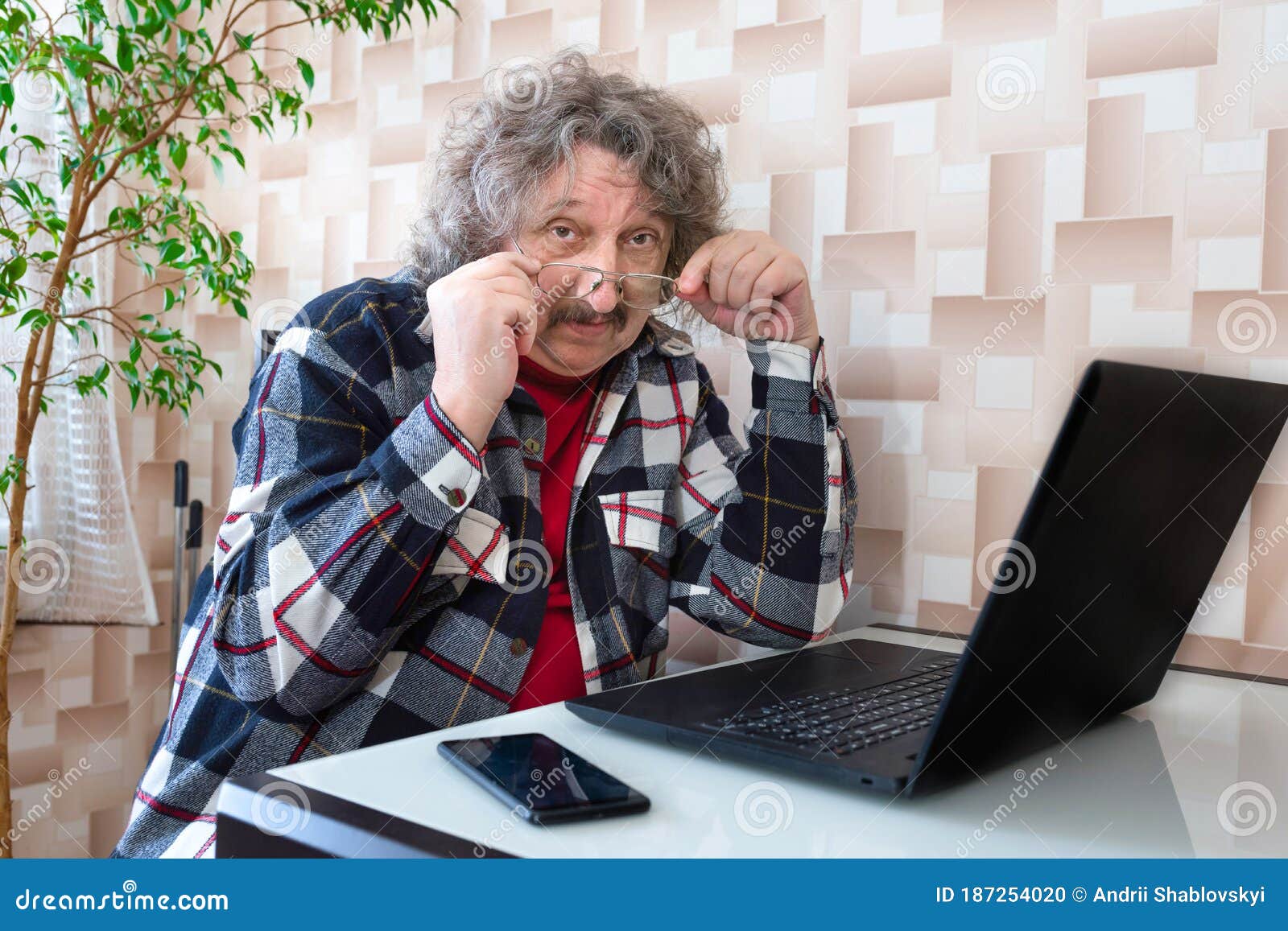 An Elderly Man in Glasses Working at the Laptop Stock Photo - Image of ...